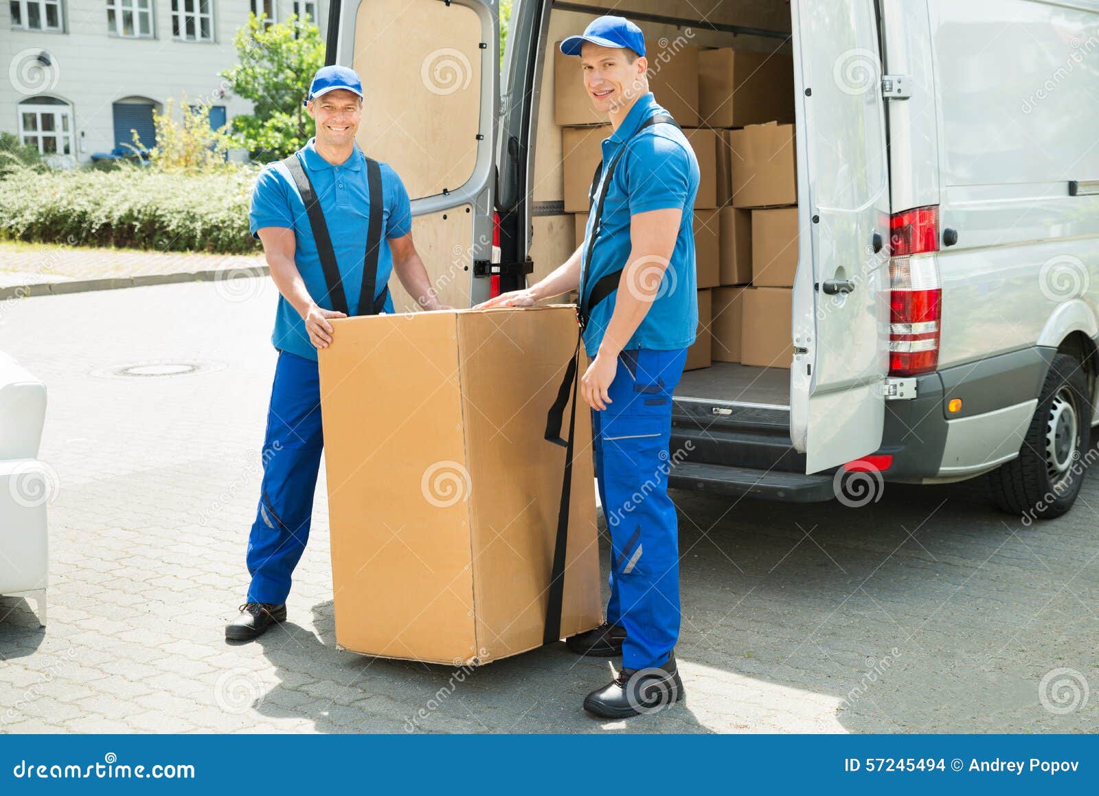 Two Movers Loading Boxes in Truck Stock Photo - Image of moving ...