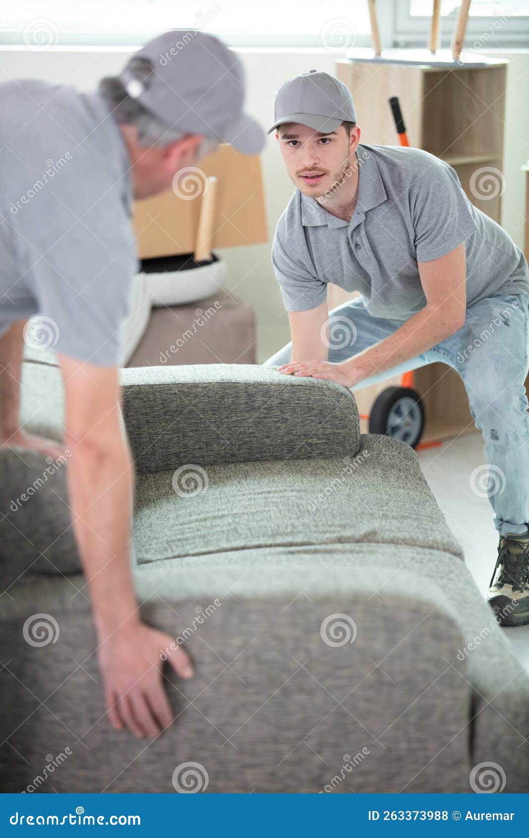 Two Movers Men Carrying Sofa Stock Photo - Image of property, home ...
