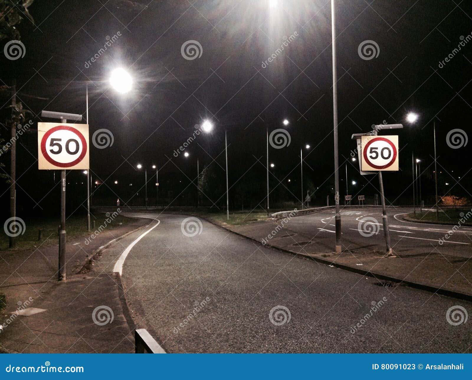 Two 50 MPH signs on road editorial stock photo. Image of road - 80091023
