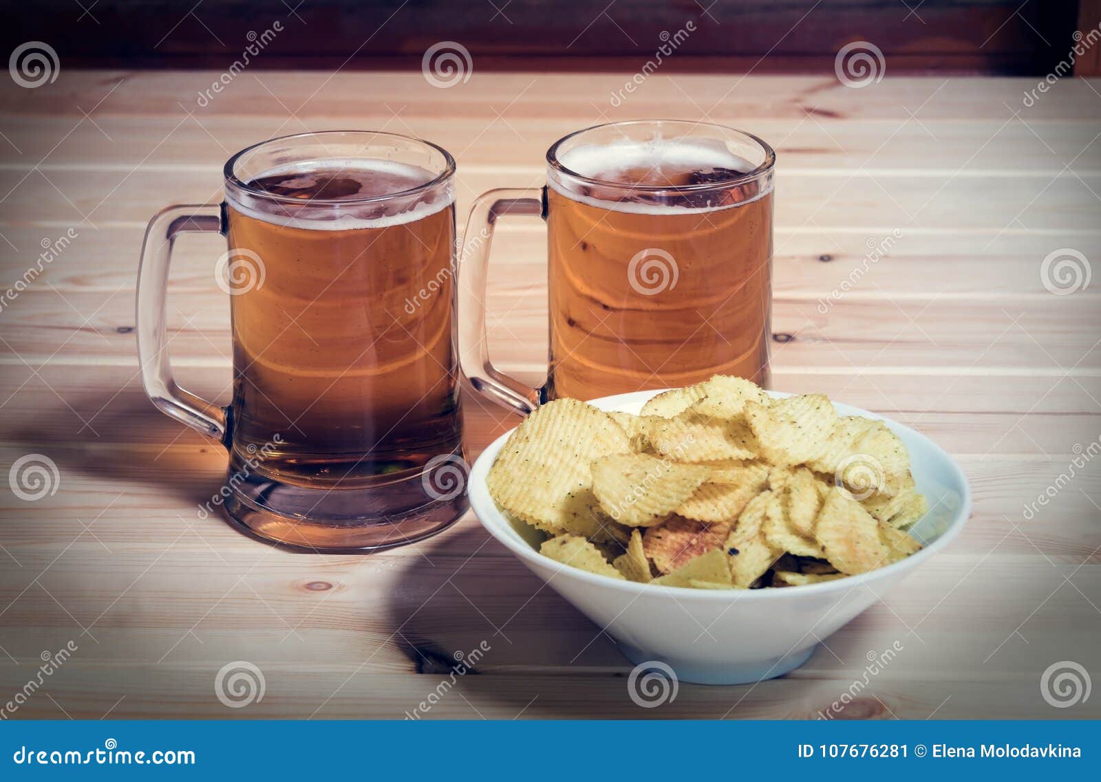 Two Mugs of Beer and Bowl of Potato Chips Stock Image - Image of ...