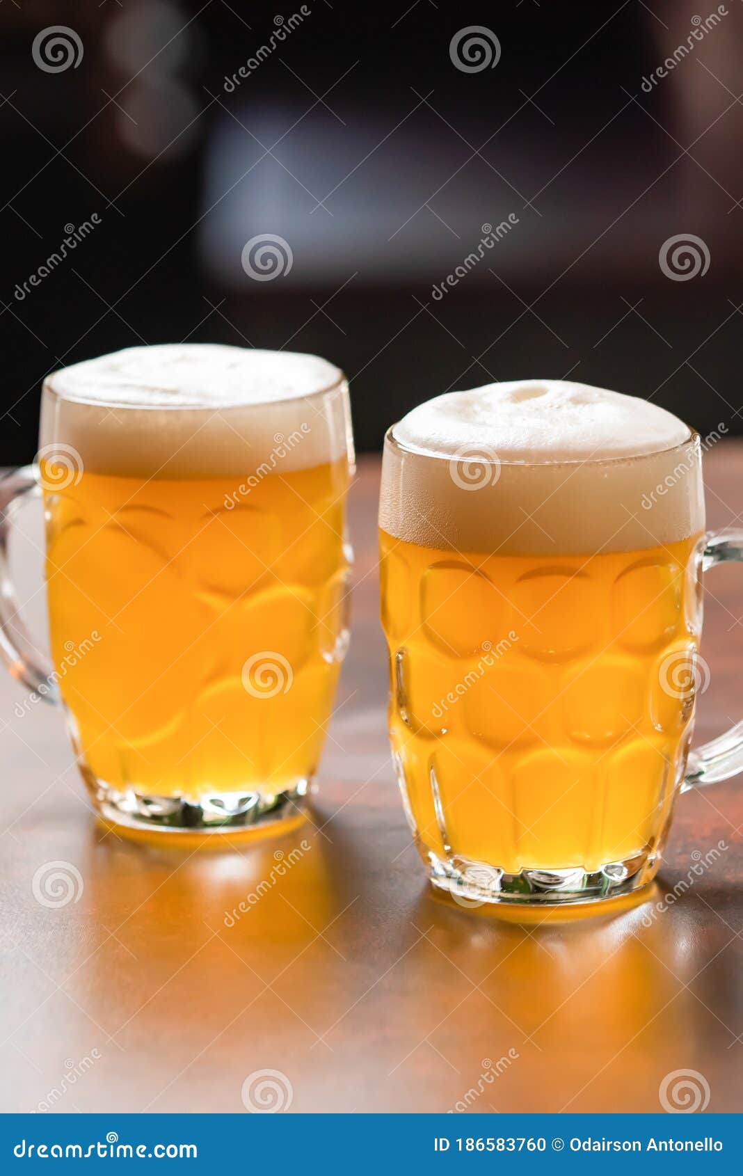 Two Mugs Full Of Chopp, With Chopp Pilsen On A Rustic Table. Stock ...