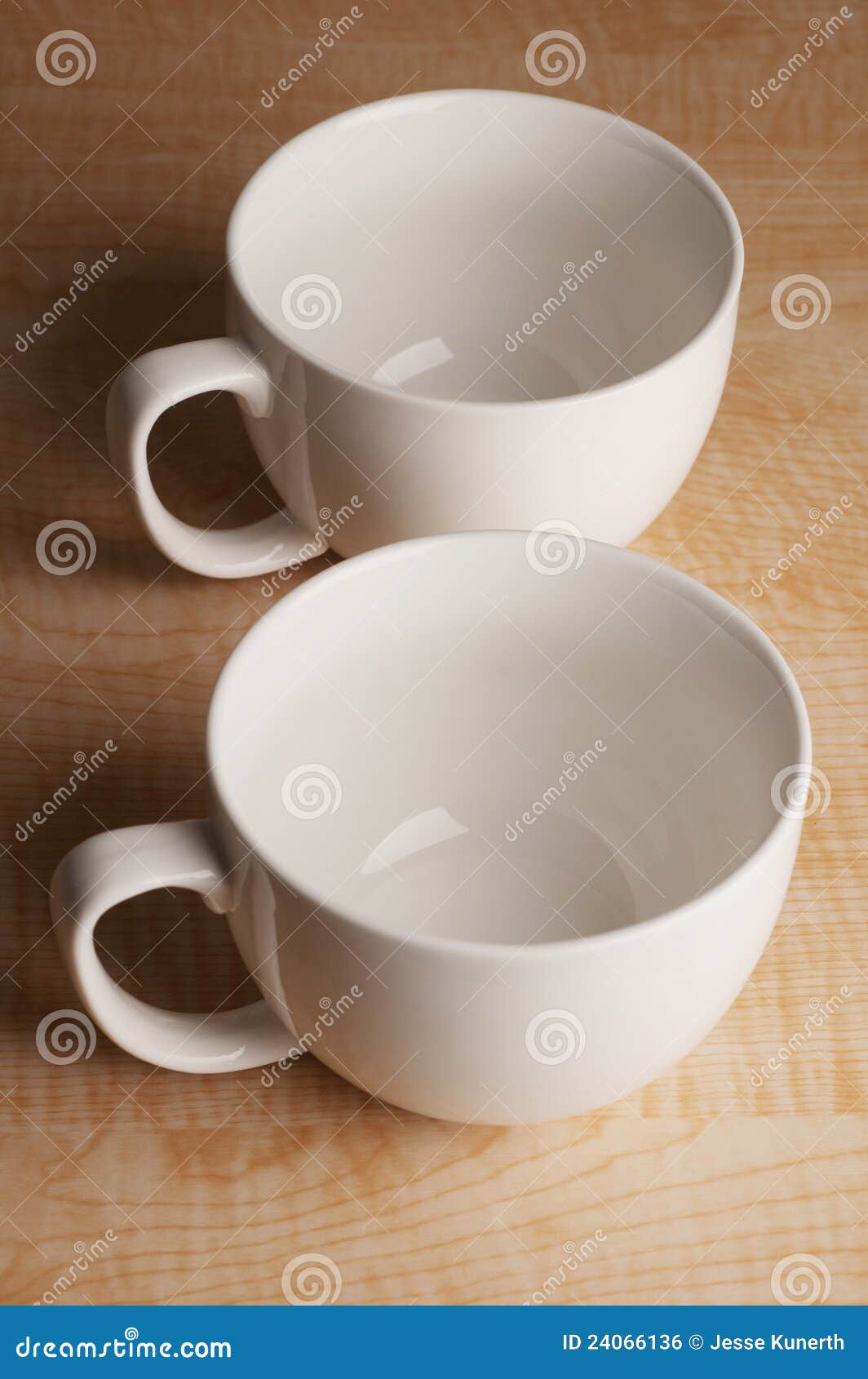 Two Mugs on Wooden Table stock photo. Image of mugs, porcelain - 24066136