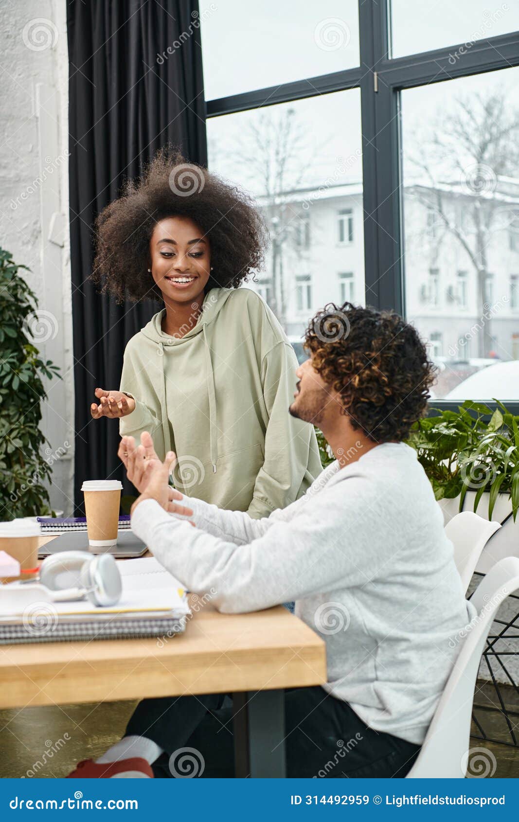Two Multicultural Students Engrossed in Conversation Stock Image ...