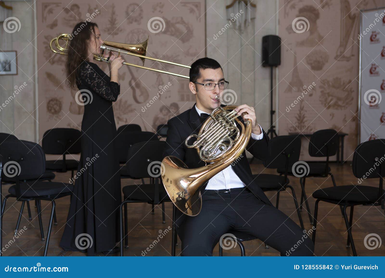 Two Musicians Playing on Wind Instruments Stock Photo - Image of people ...