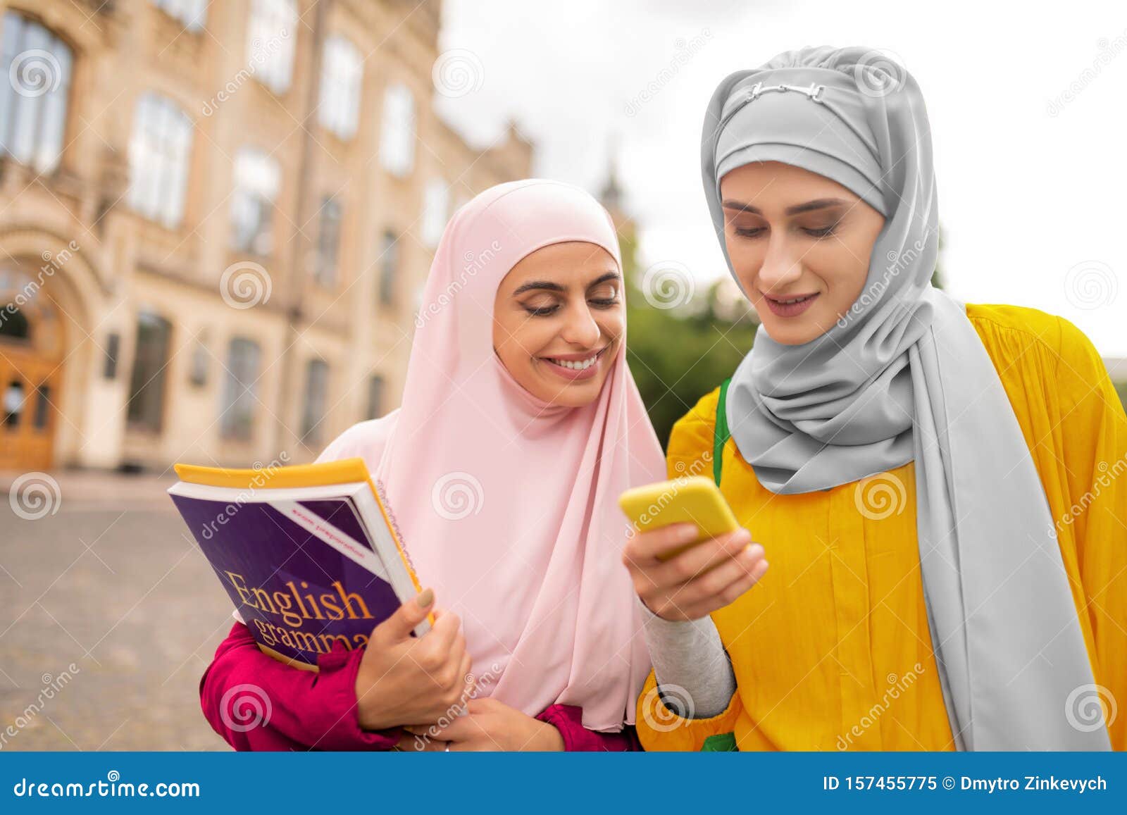 Two Muslim Women Using Smartphone while Using Online Maps Stock Image ...