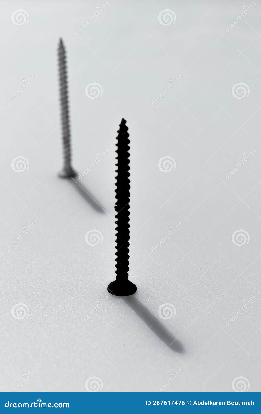 Two nails stock photo. Image of wing, lighting, hand - 267617476