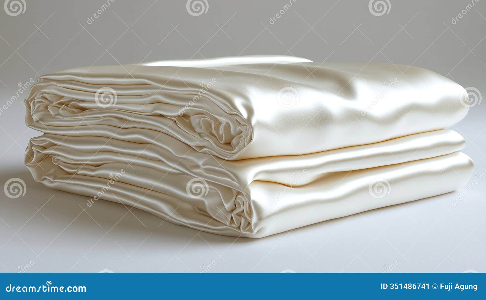 Two Neatly Folded Stacks of Luxurious, Creamy-white Satin Fabric Sheets ...