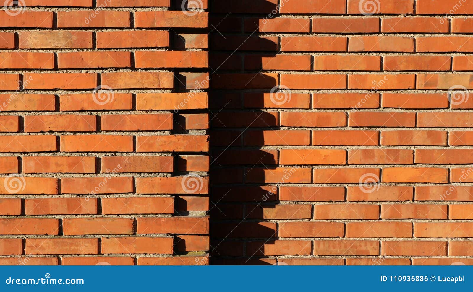 Two Neighboring Brick Walls, with the Shadows of the Bricks of the ...