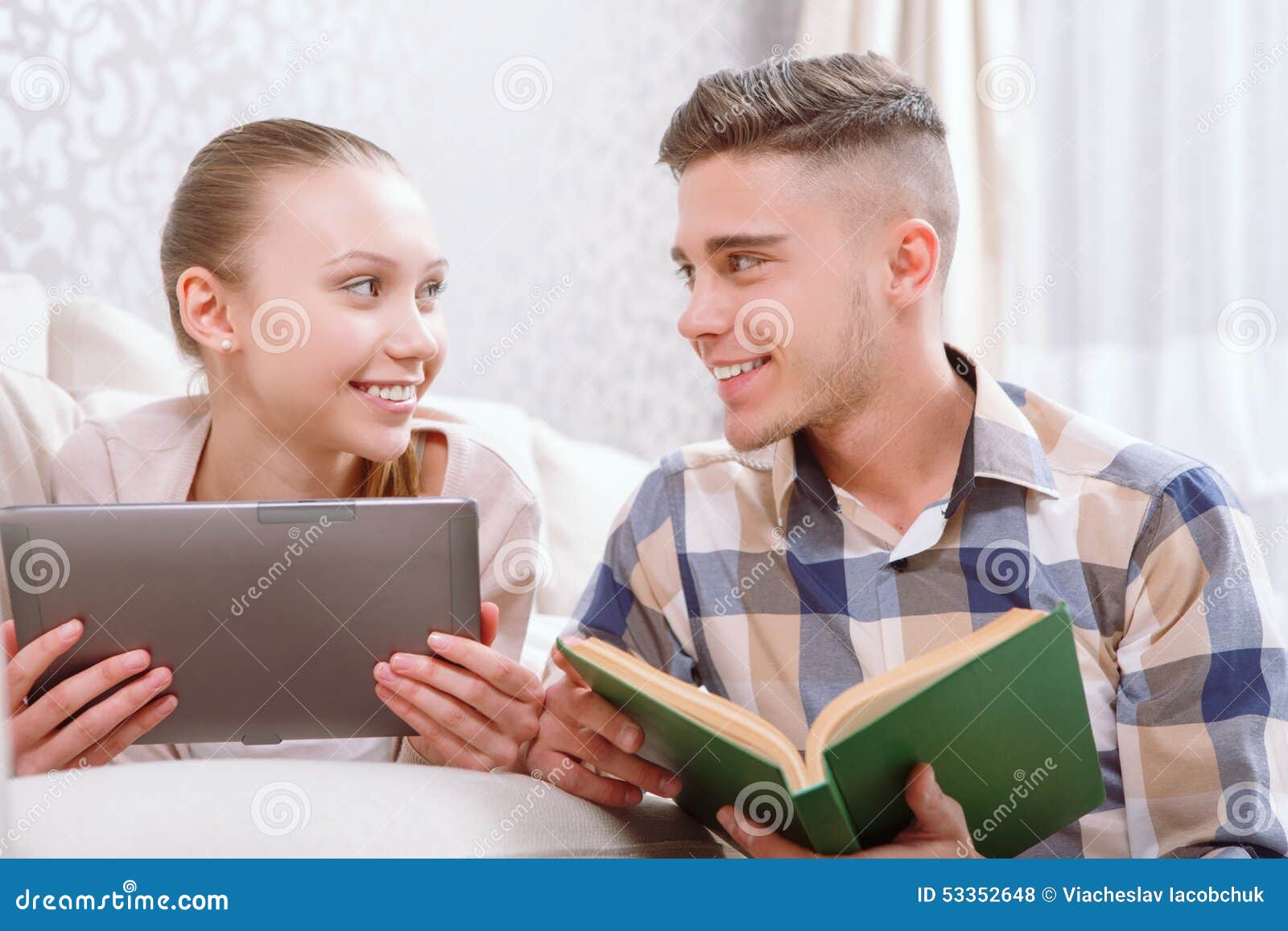 Two Nice Young People Reading Stock Photo - Image of cheerful, read ...