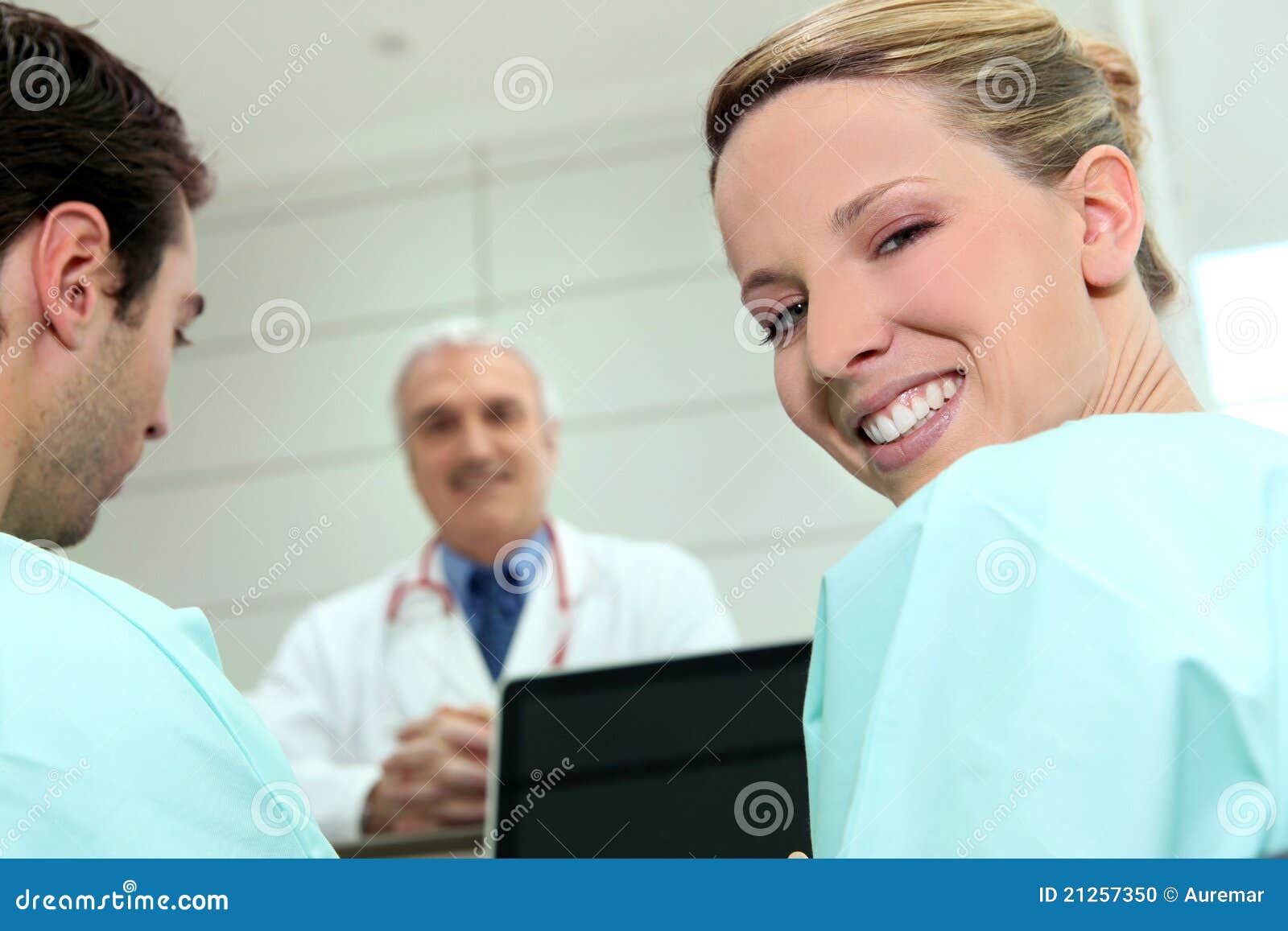 Two nurses and a doctor stock photo. Image of paper, illness - 21257350