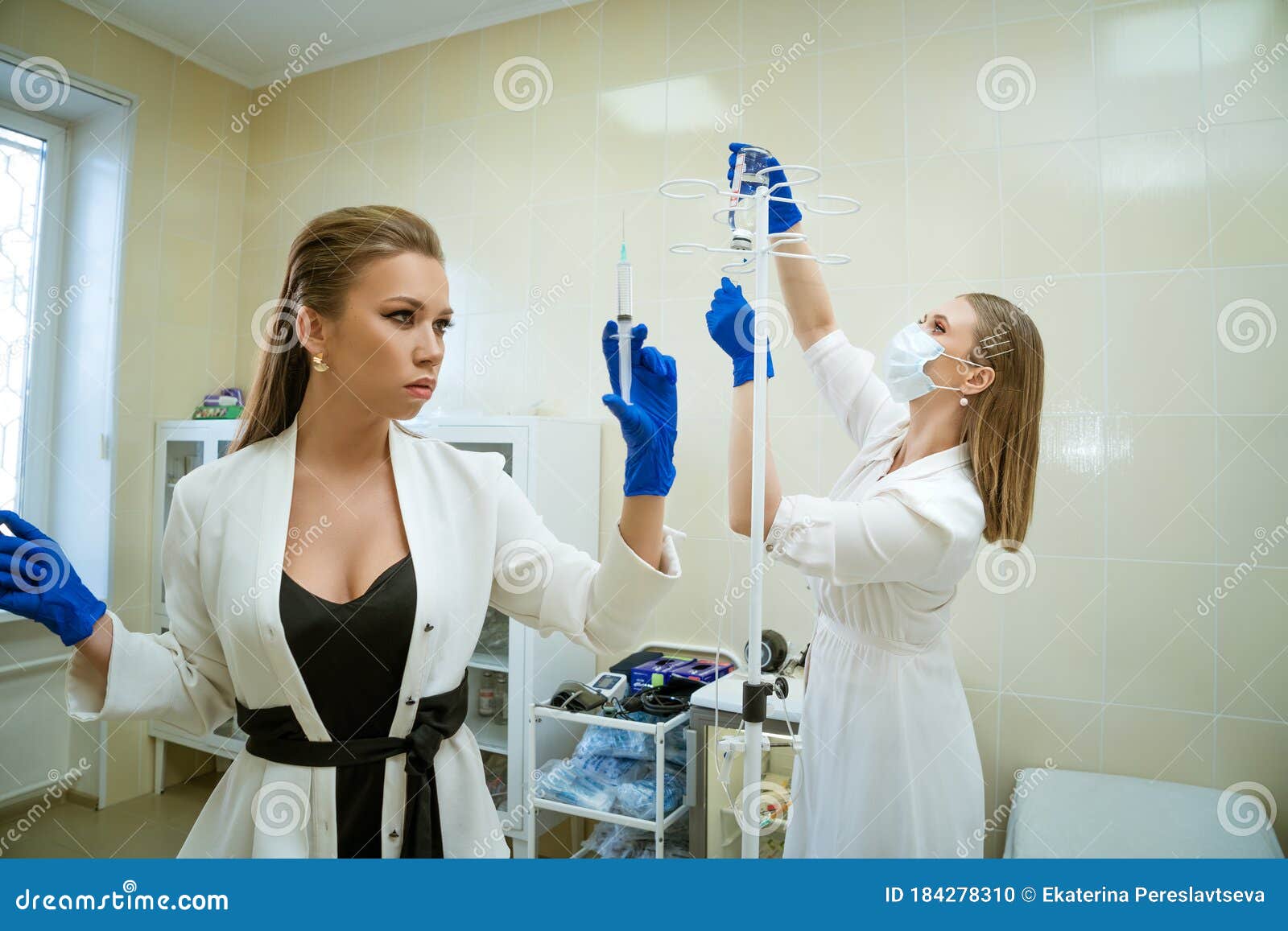 Two Nurses with a Syringe in Their Hands Stock Photo - Image of ...