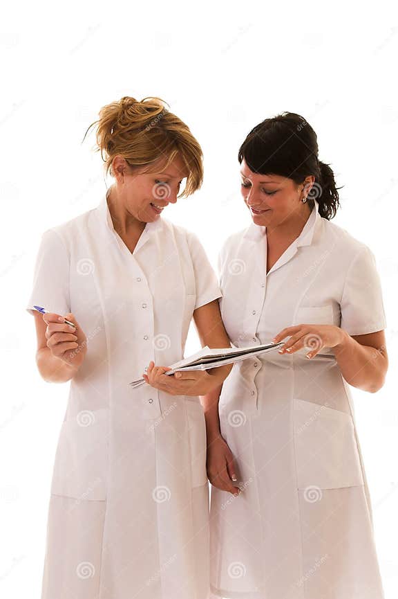 Two nurses working stock image. Image of notebook, nurses - 2181141