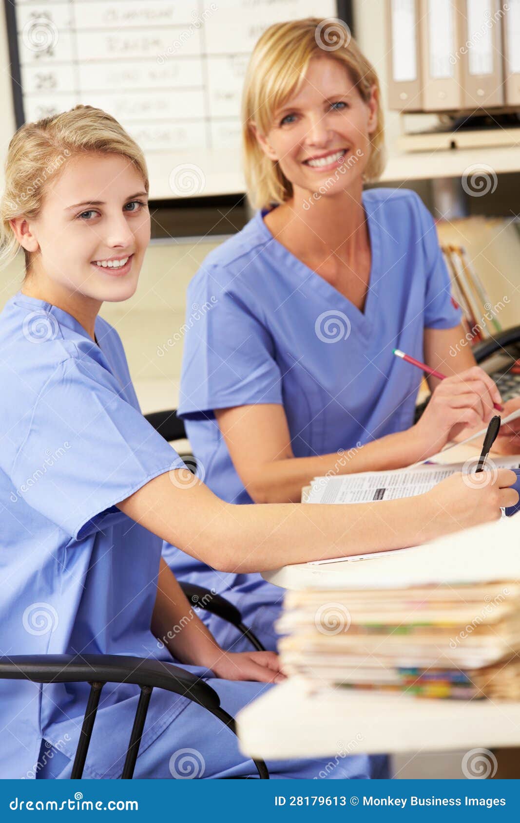 Two Nurses Working at Nurses Station Stock Image - Image of care ...