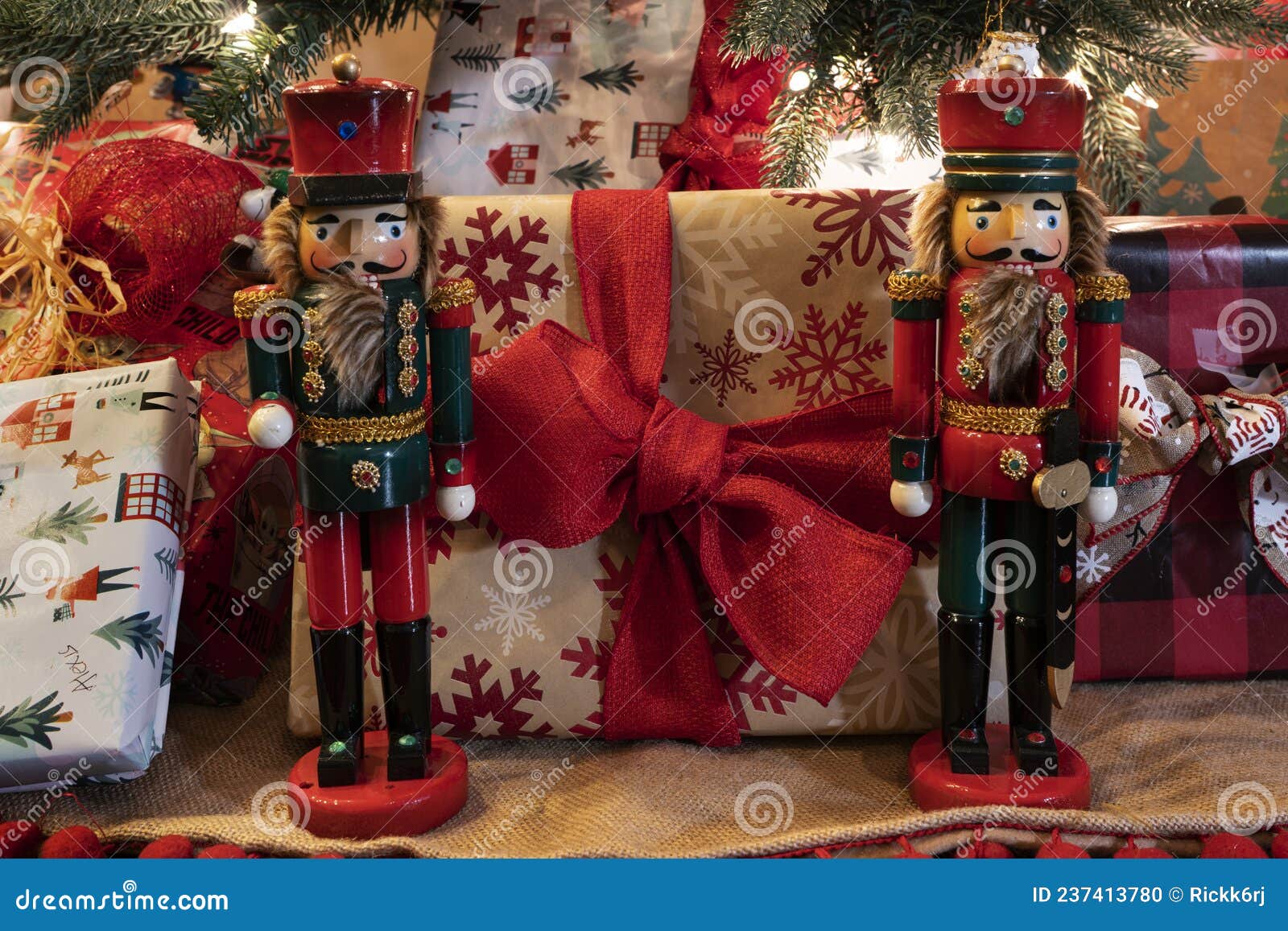 Two Nutcrackers Under the Christmas Tree with Presents Stock Photo ...