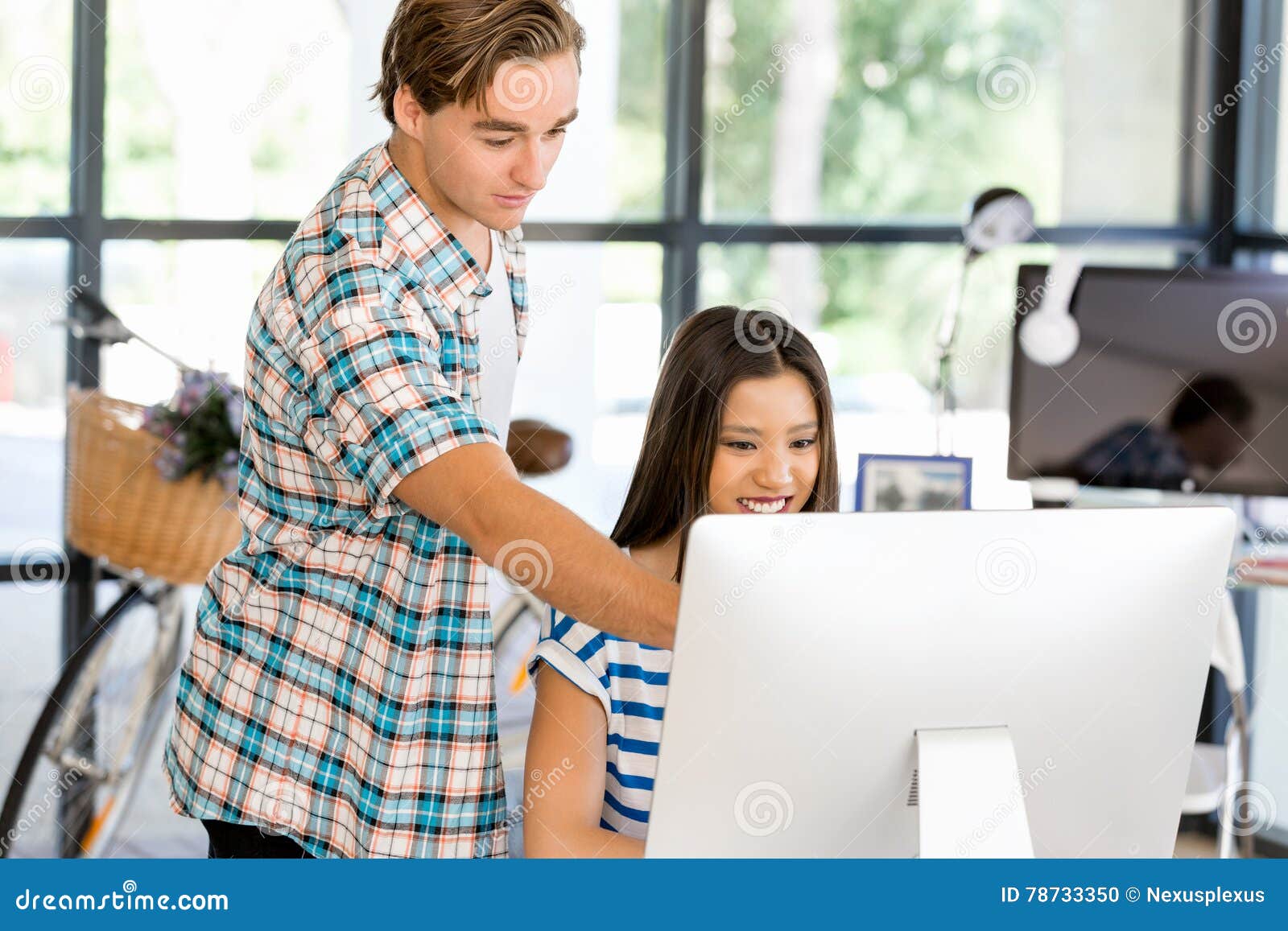 Two Office Workers at the Desk Stock Photo - Image of pointing, friends ...