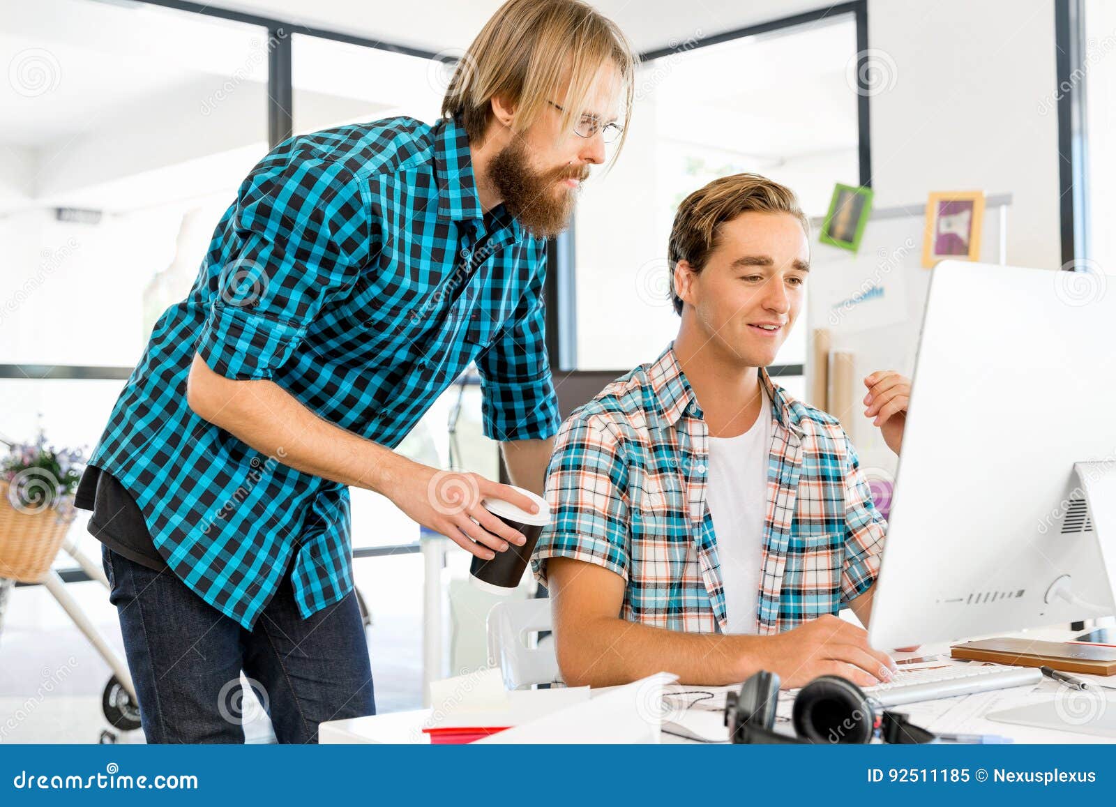 Two Office Workers at the Desk Stock Image - Image of pointing, happy ...