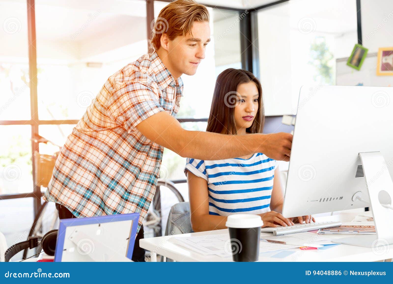 Two Office Workers at the Desk Stock Photo - Image of computer ...