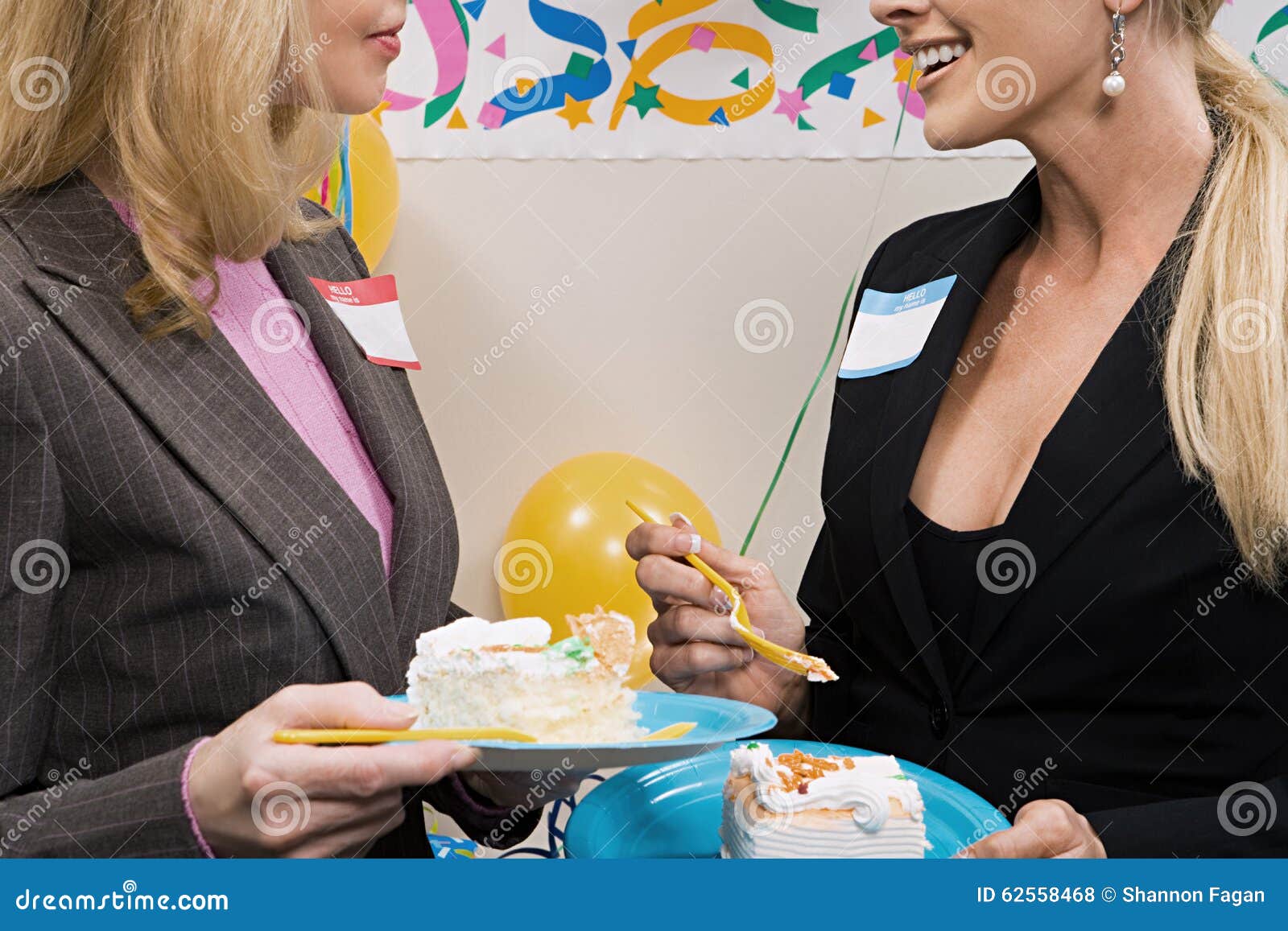 Two Office Workers Eating Cake Stock Photo - Image of eating, head ...