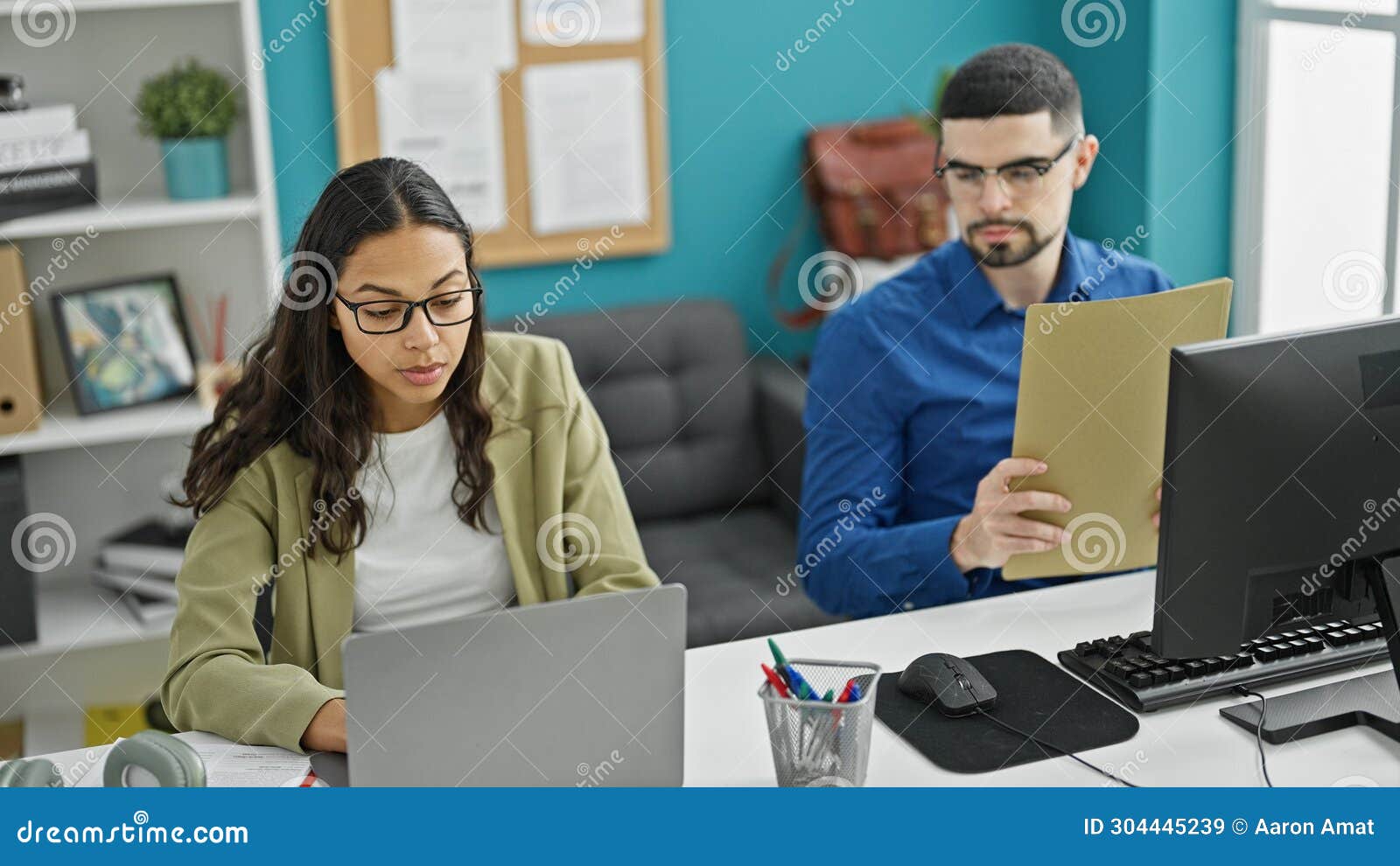 Two Office Workers, a Man and Woman, Sitting at a Table, Entangled in a ...