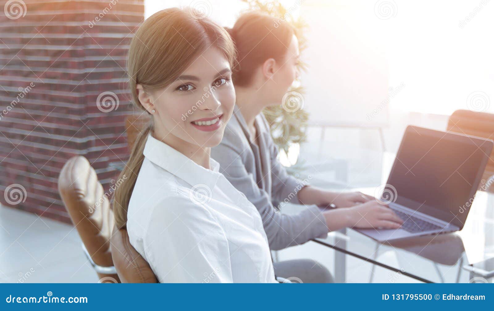 Office Workers Sitting Behind a Desk. Stock Photo - Image of assistant ...