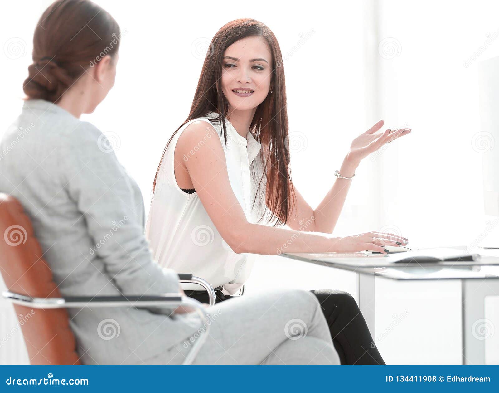 Two Office Workers Talking in the Workplace Stock Photo - Image of ...