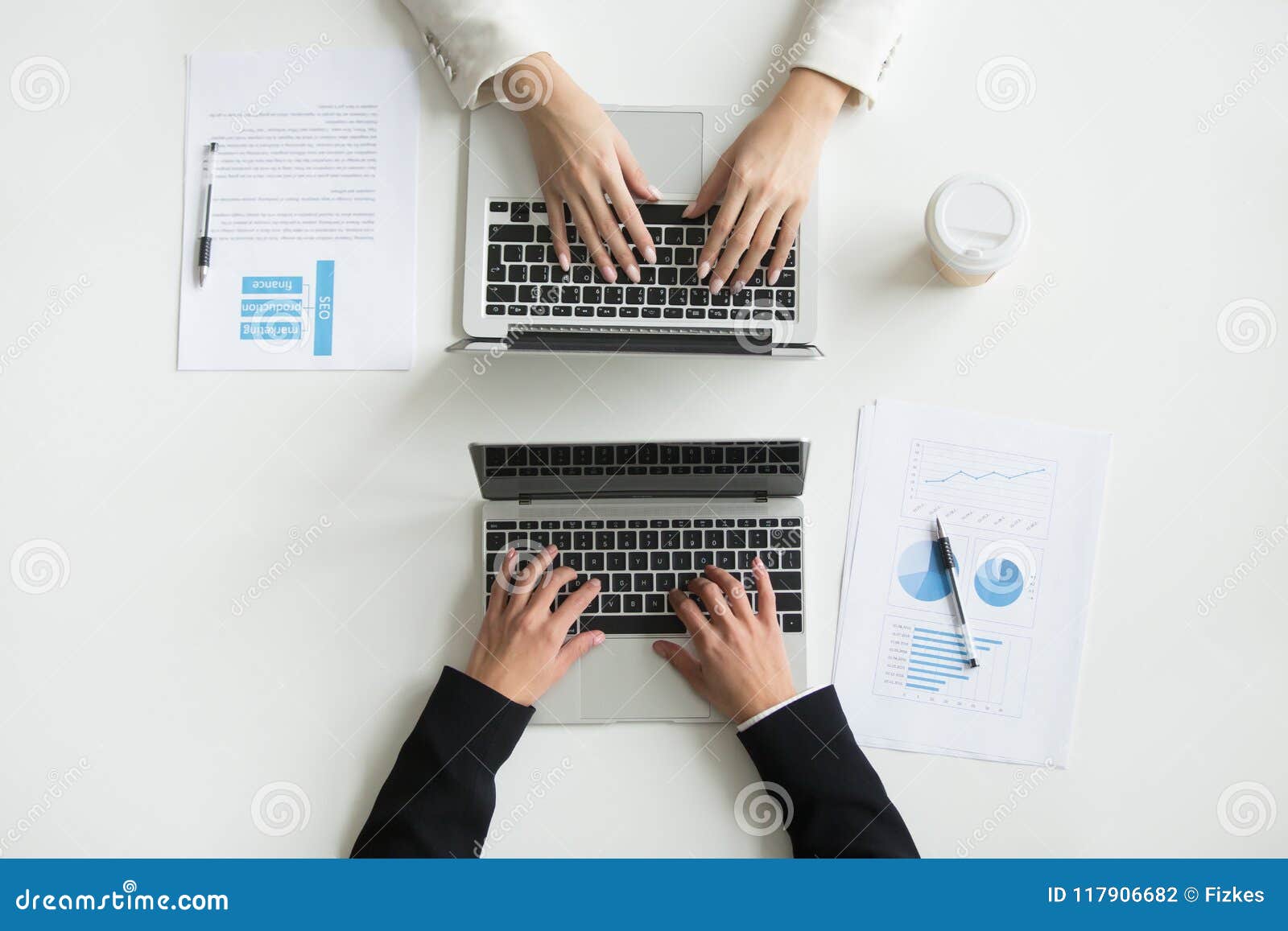 Two Office Workers Typing on Laptops, Top Close Up View Stock Photo ...