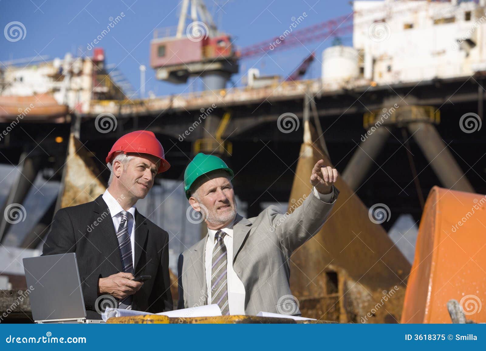 Two Oil Platform Inspectors with a Laptop Stock Image - Image of ...