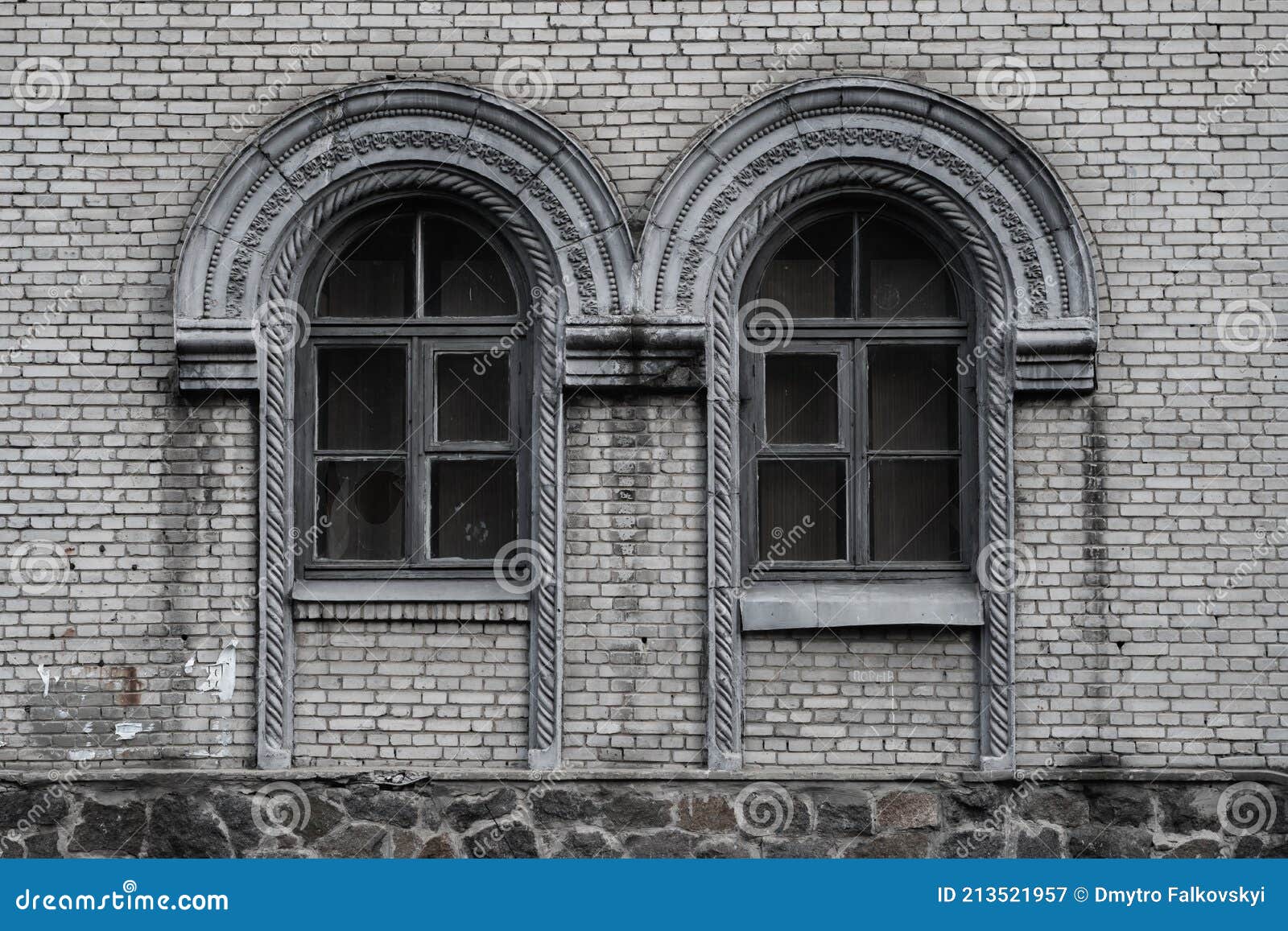 Two Old Ached Windows on the Brick Wall of an Abandoned Old Building in ...
