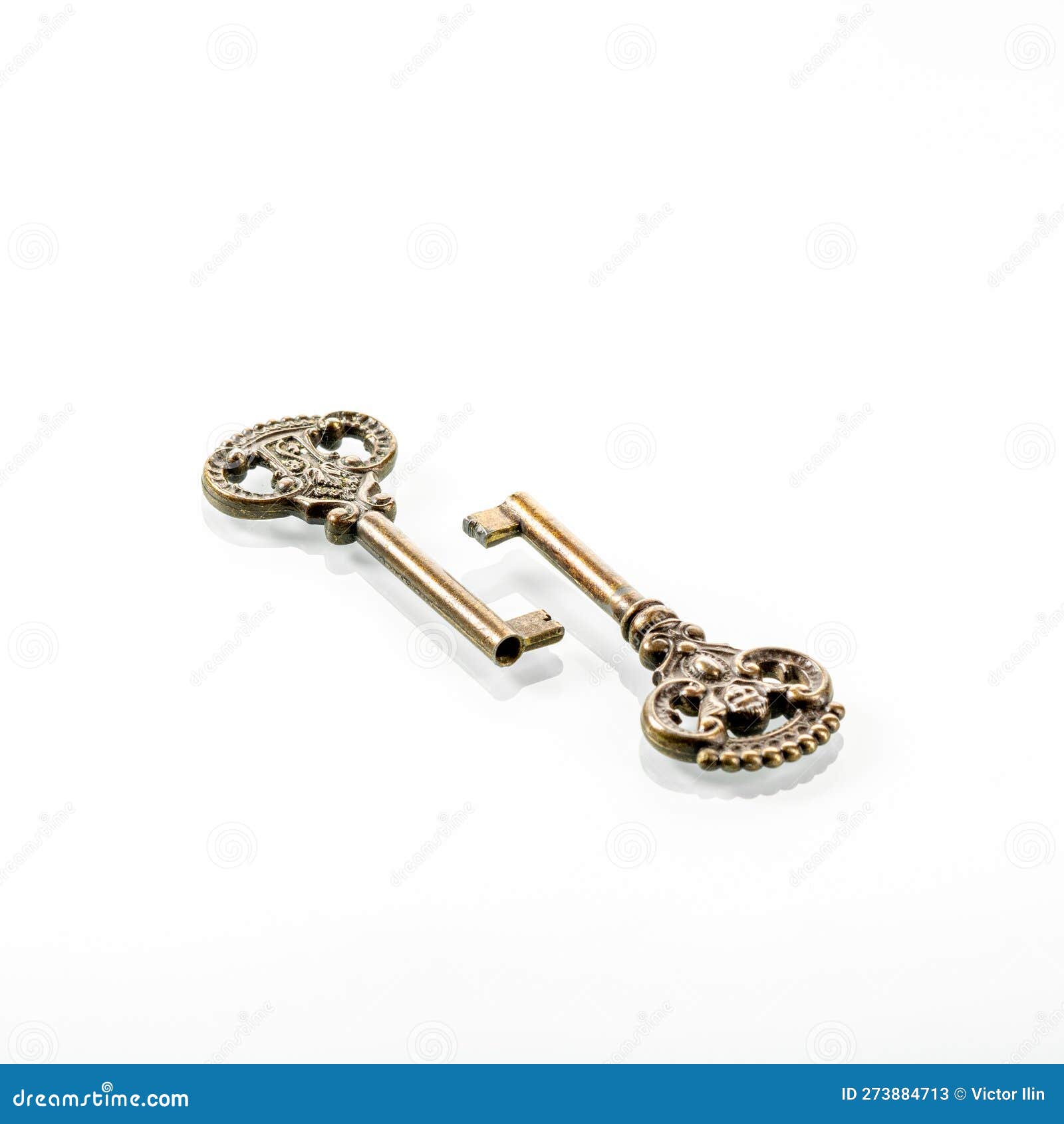 Two Old Bronze Keys with Reflection in a White Mirror Background Stock ...