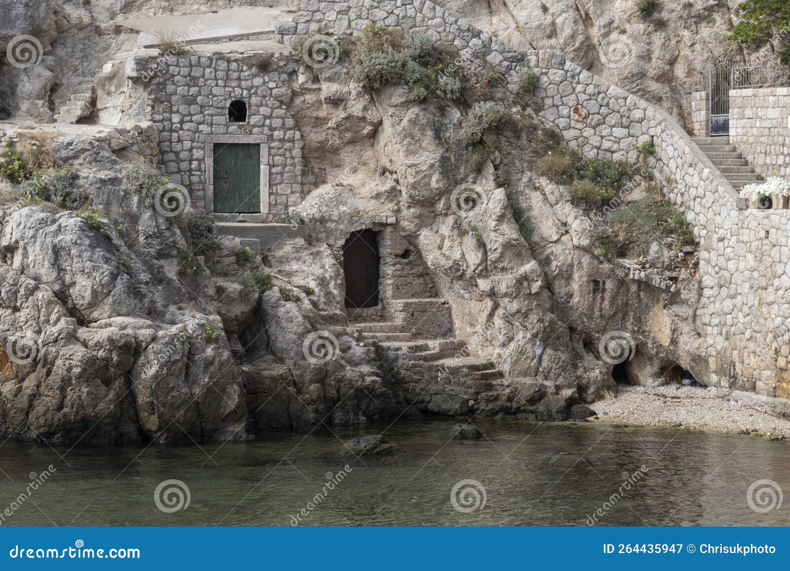 Two Old Doors in a Cliff in a Bay in Dubrovnik Stock Image - Image of ...