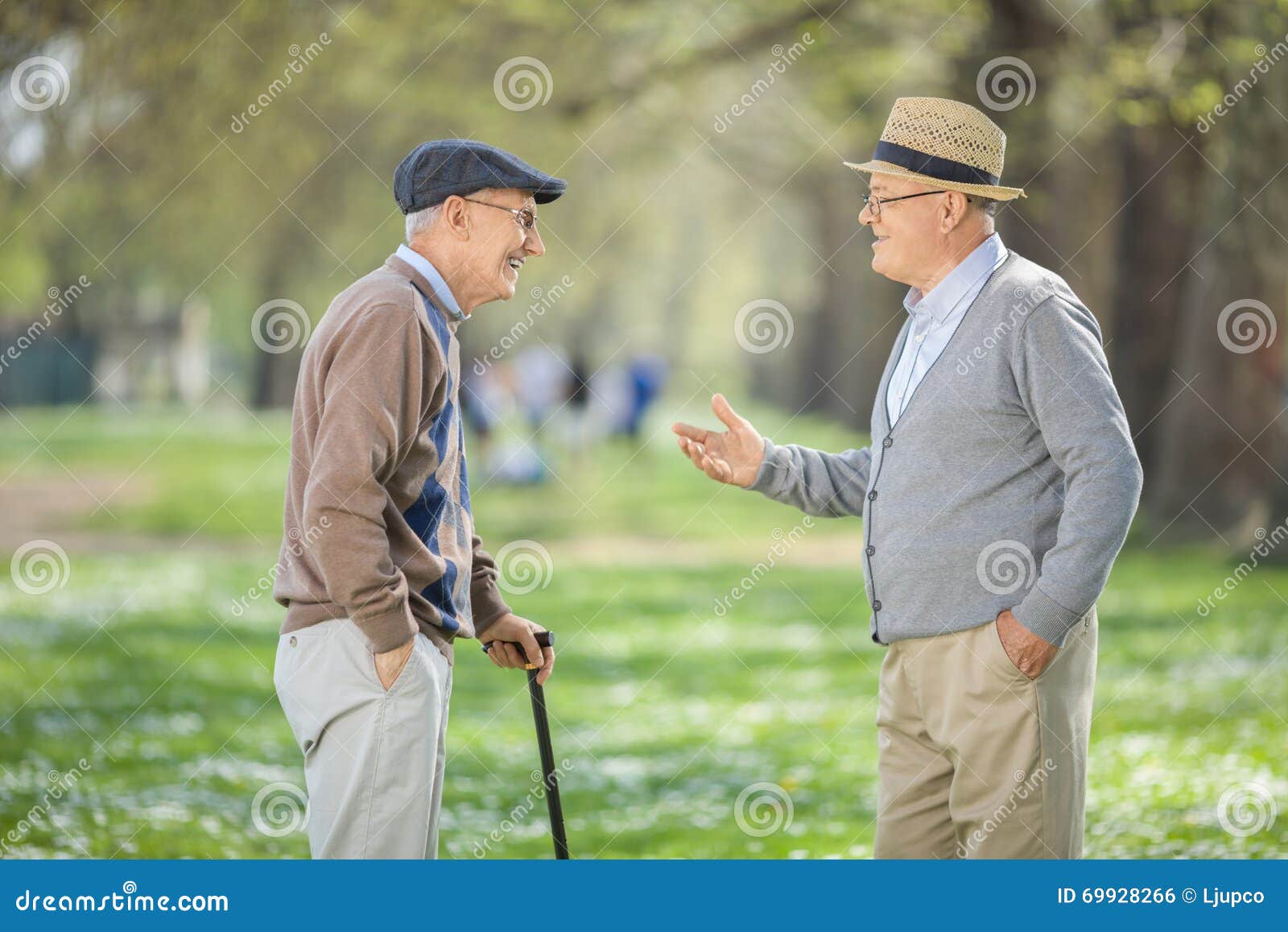 Two Old Friends Having a Conversation in a Park Stock Photo - Image of ...