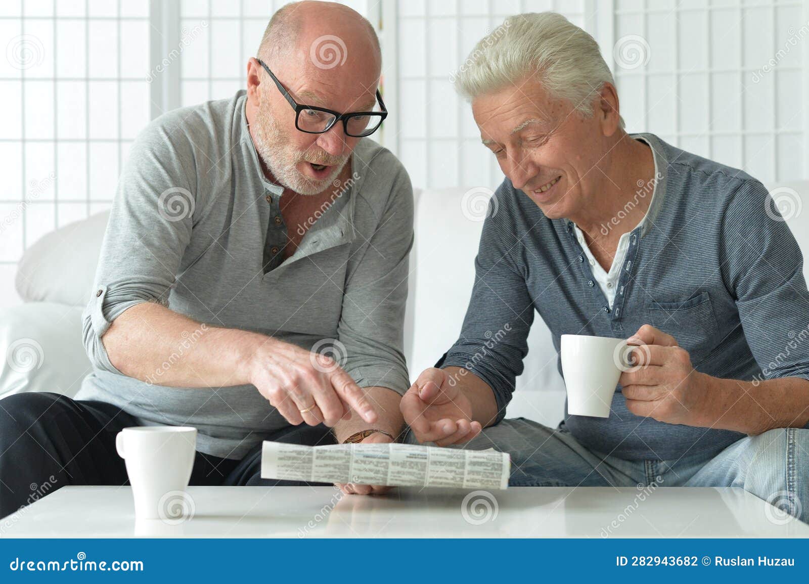 Two Old Men Sitting at Table and Discussing News Stock Photo - Image of ...