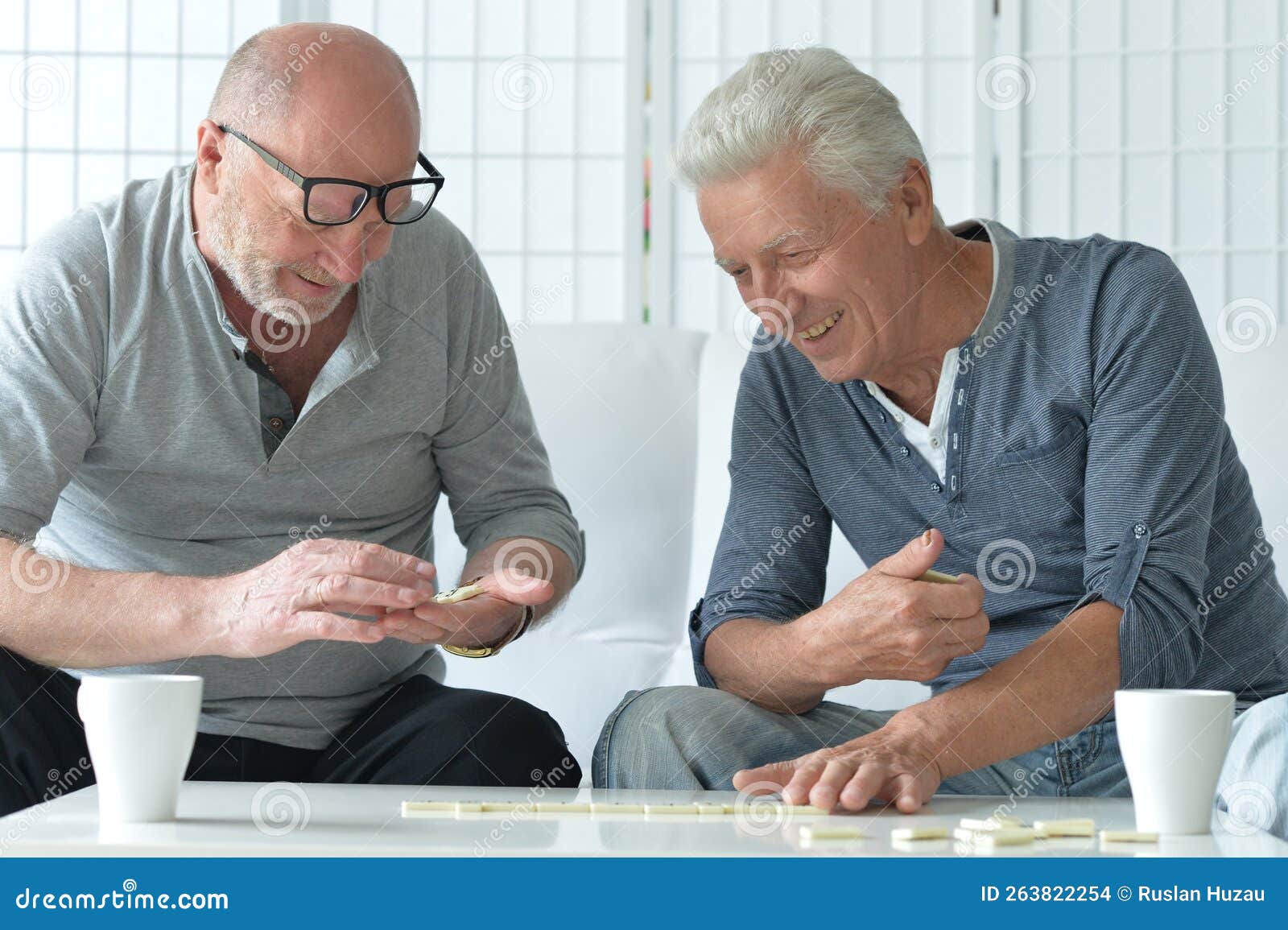 Two Old Men Sitting at Table and Playing Domino Stock Photo - Image of ...