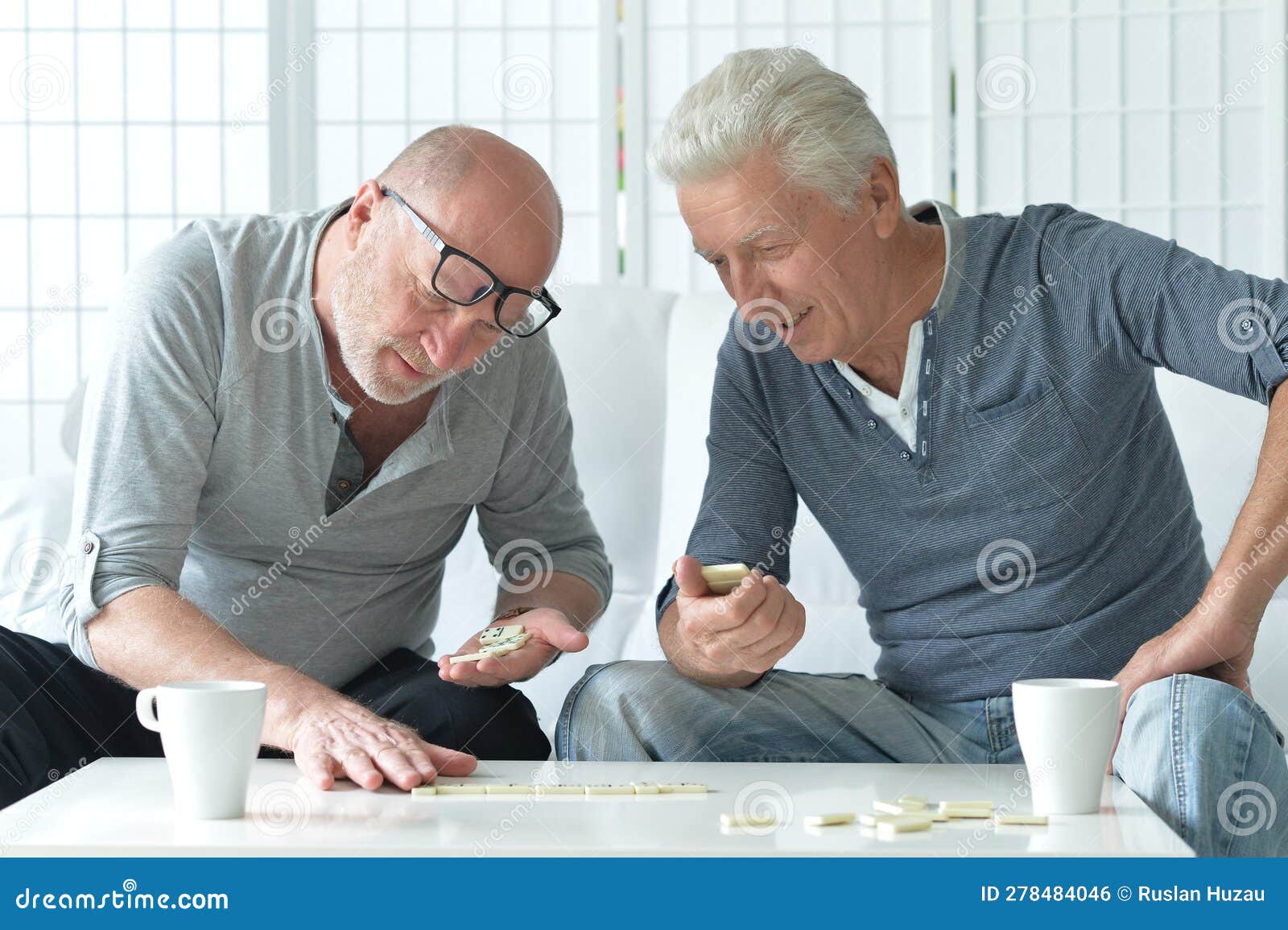 Two Old Men Sitting at Table and Playing Domino Stock Photo - Image of ...
