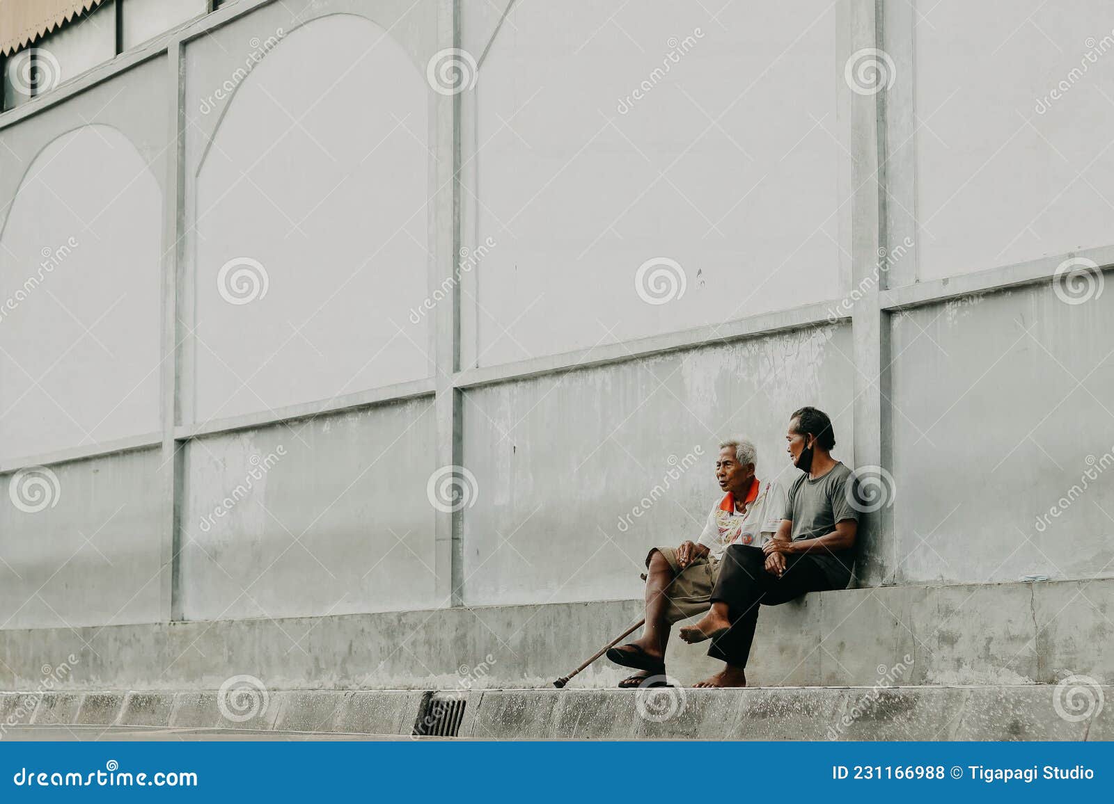 Two Old People Talking Casually on the Roadside in the Afternoon ...