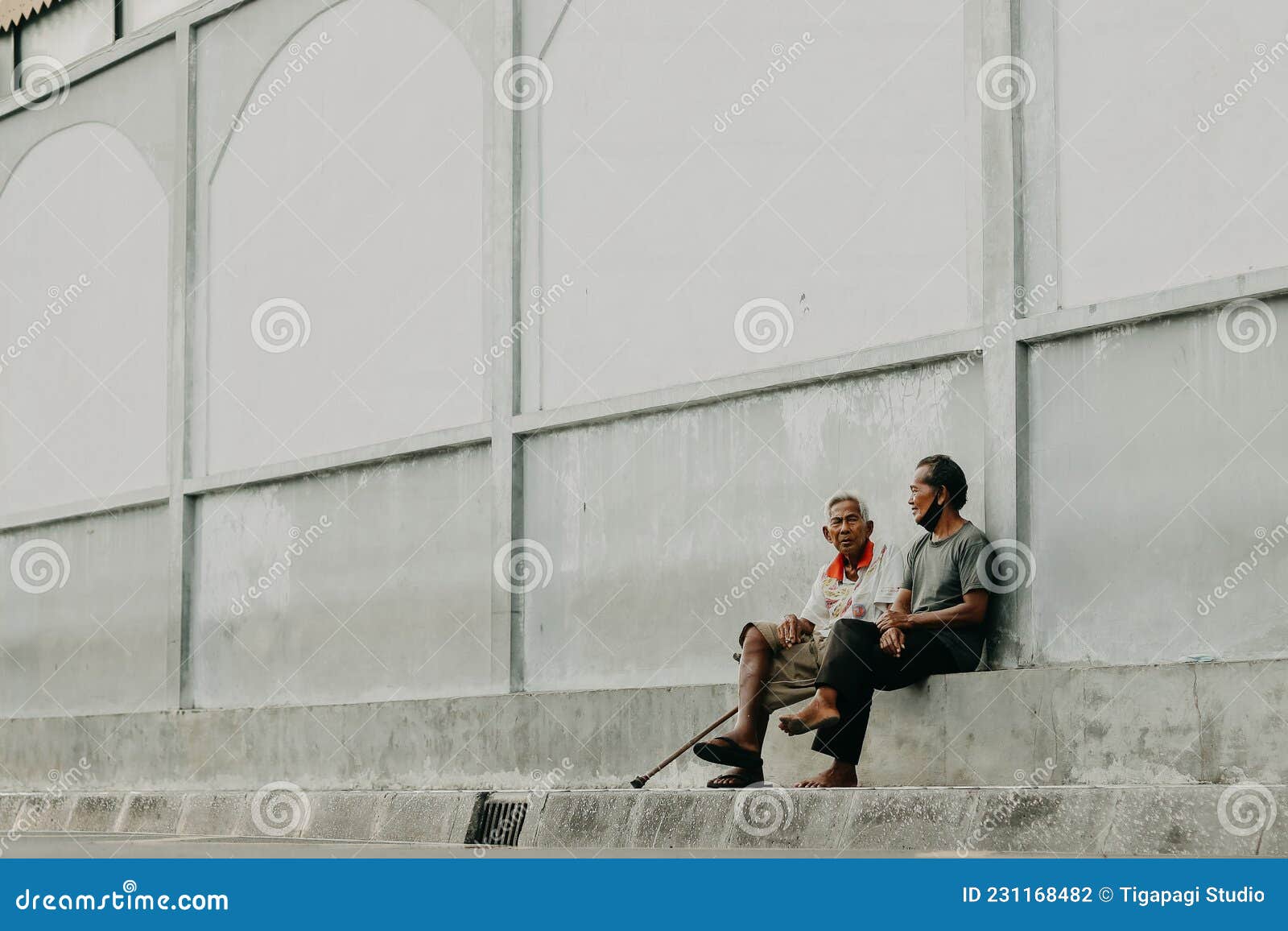 Two Old People Talking Casually on the Roadside in the Afternoon ...