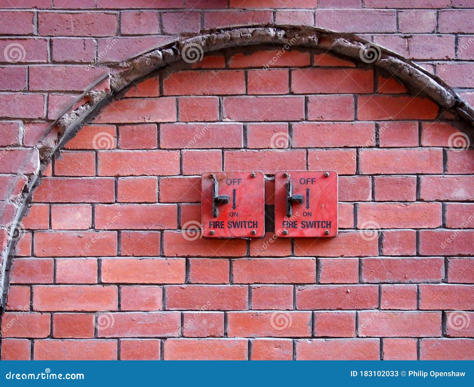 Two Old Red Metal Fire Switches on an Exterior Brick Wall Stock Image ...