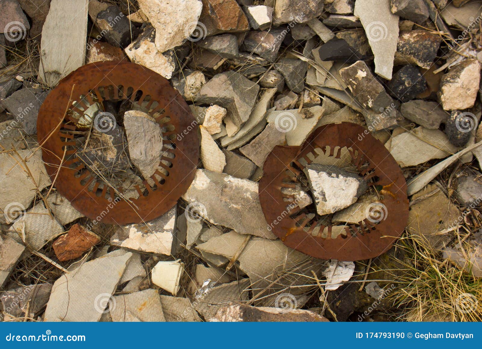 The Two Old Rusty Rounded Steels on the Ground with Abstract Colored ...