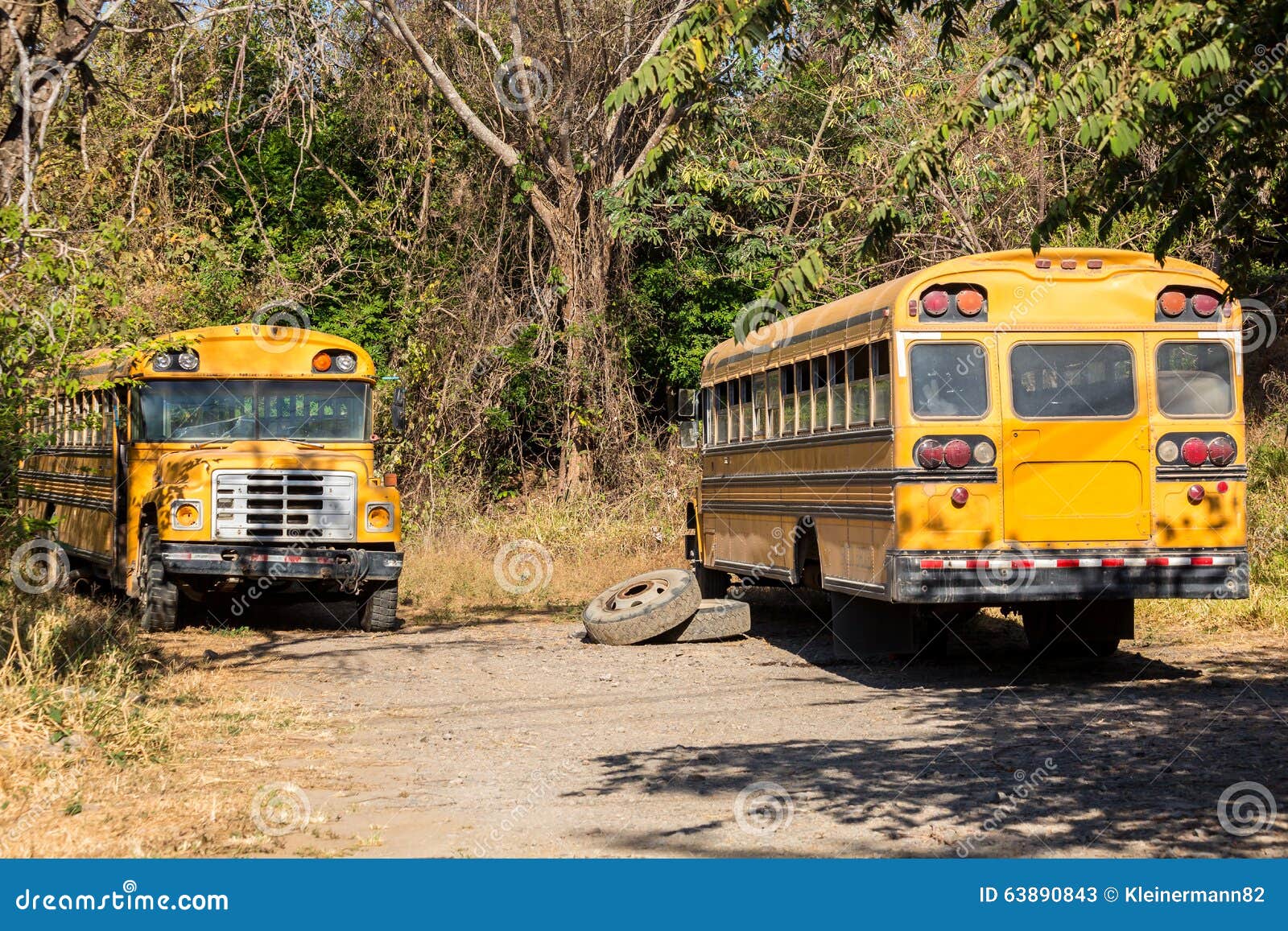 Two old rusty school bus stock image. Image of wheels - 63890843