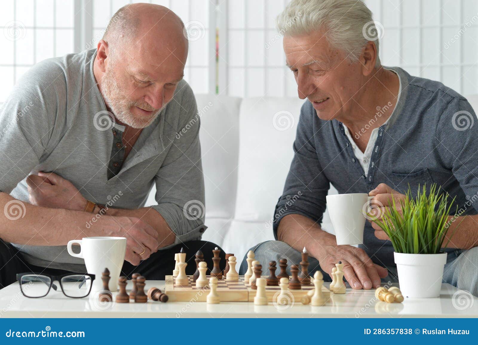 Two Old Senior Men Playing Chess at Home Stock Photo - Image of people ...