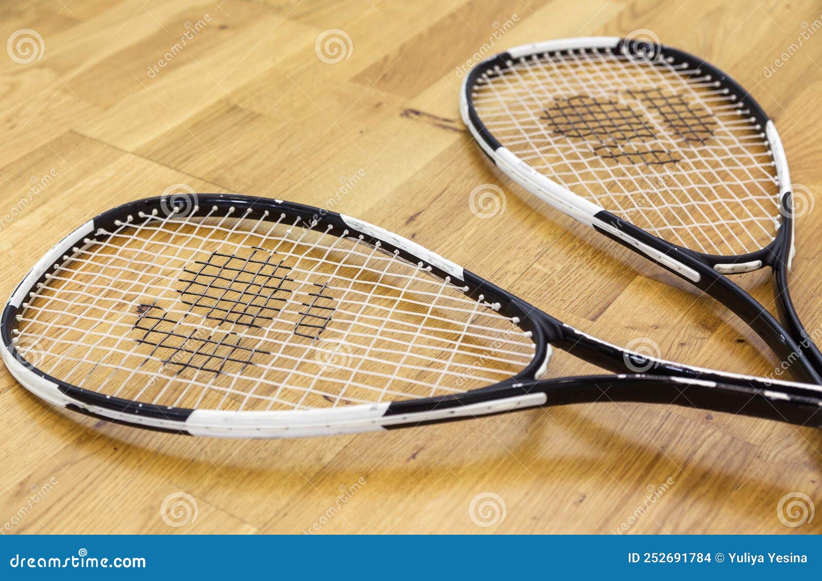 Two Old Squash Rackets Lie on a Parquet Background Editorial Stock ...