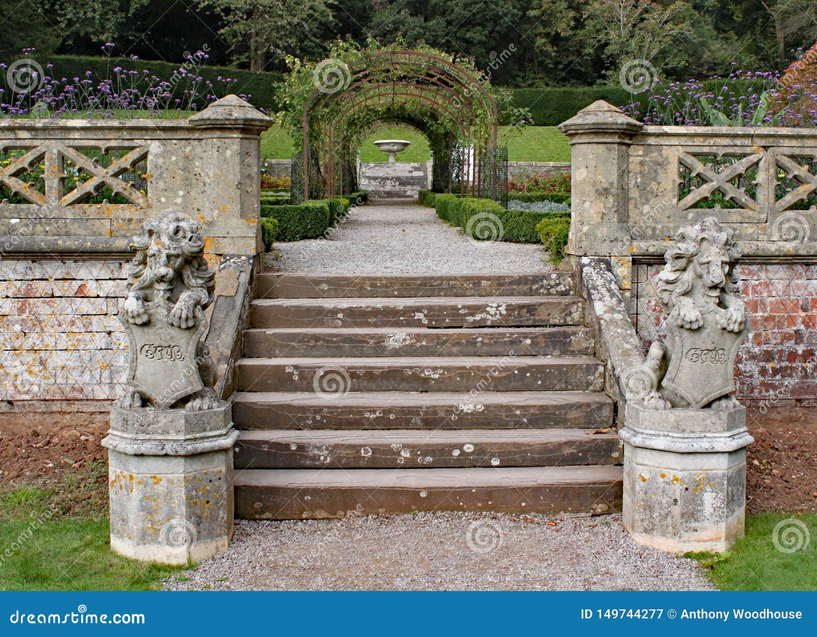Two Old Stone Lion Statues with Shields Stand at the Bottom of a Small ...