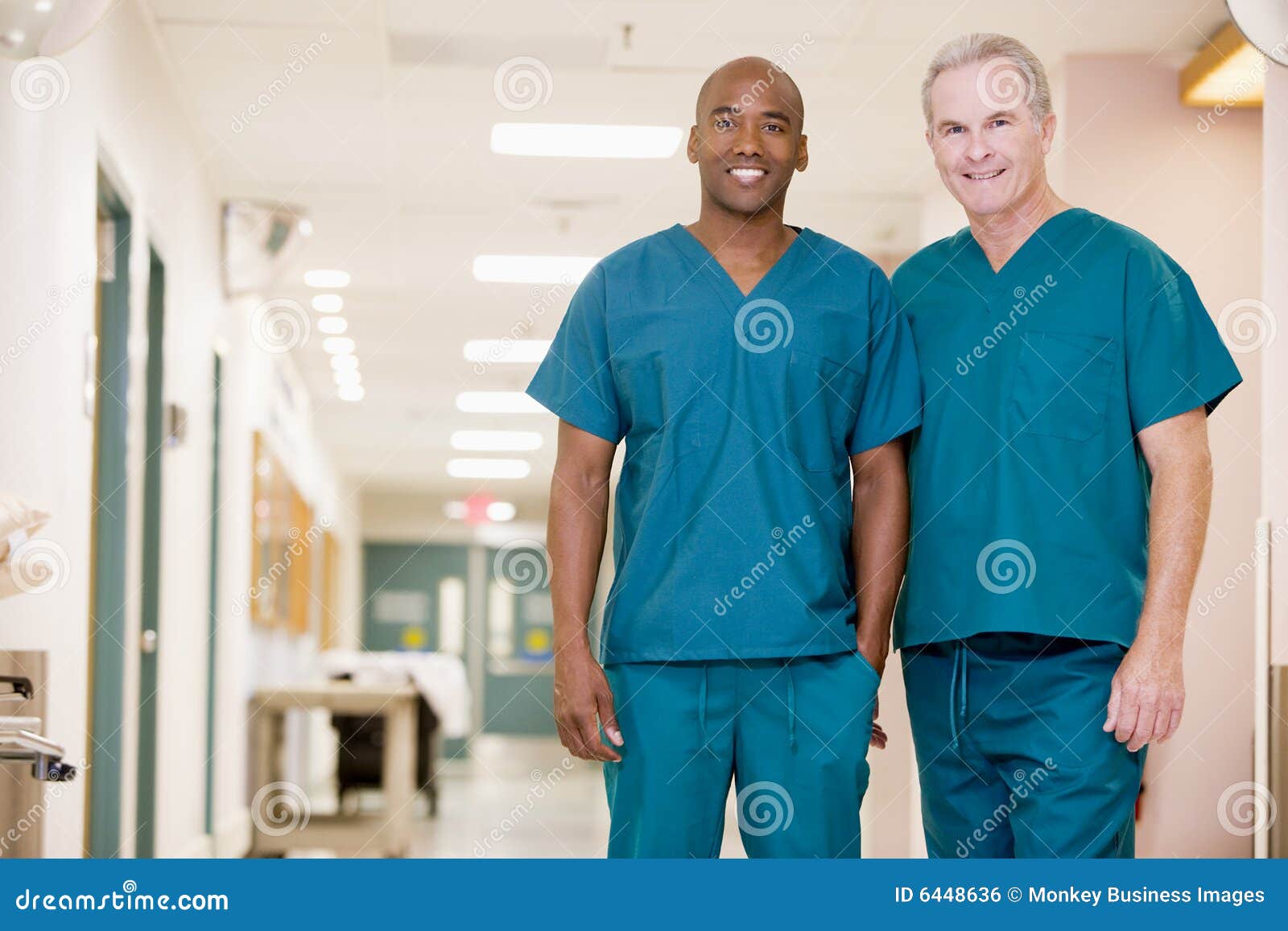 Two Orderlies Standing in a Hospital Corridor Stock Photo - Image of ...