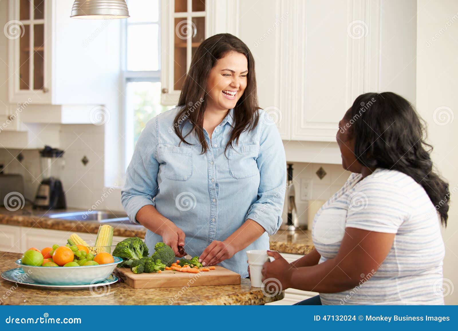 Two Overweight Women on Diet Preparing Vegetables in Kitchen Stock ...