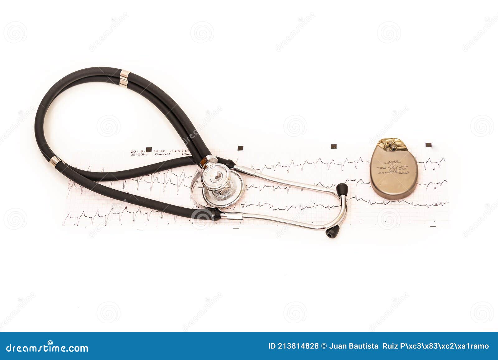 TWO PACEMAKER BATTERIES SURROUNDED by a STETHOSCOPE WHITE BACKGROUND ...