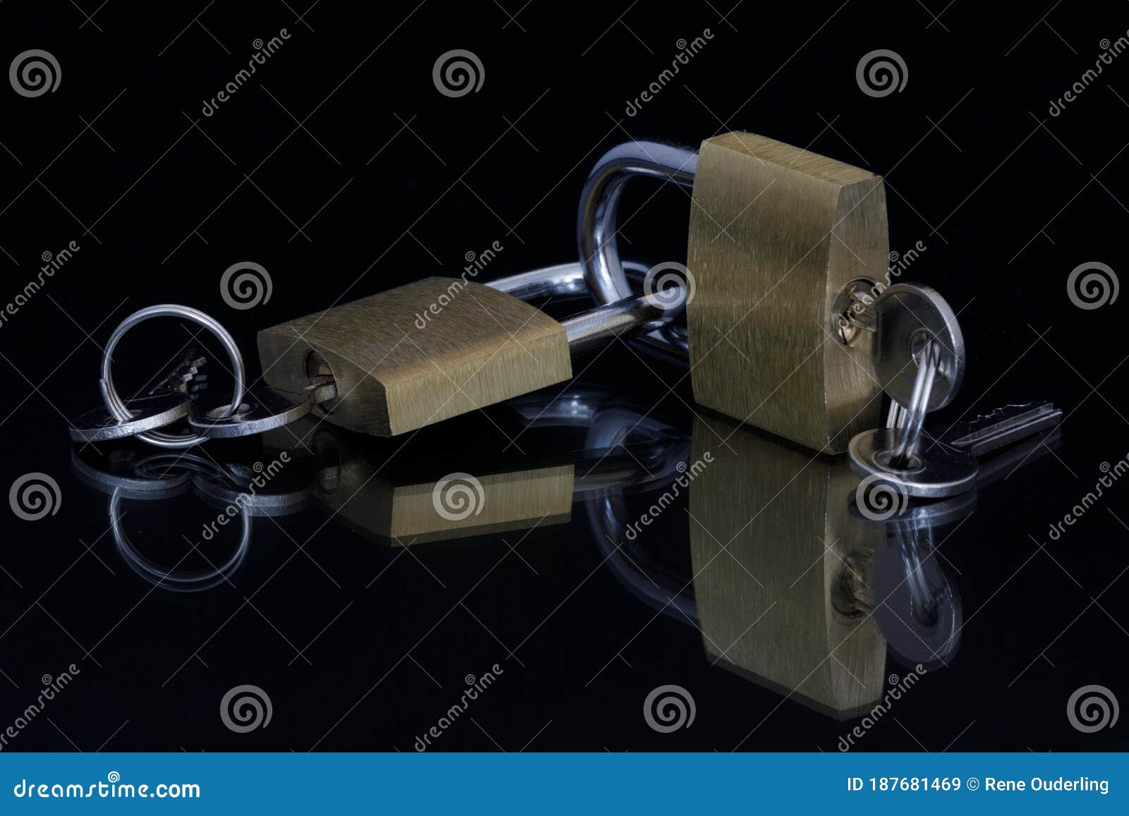 Two Padlocks Connected To Each Other One Laying and One Standing on Its ...