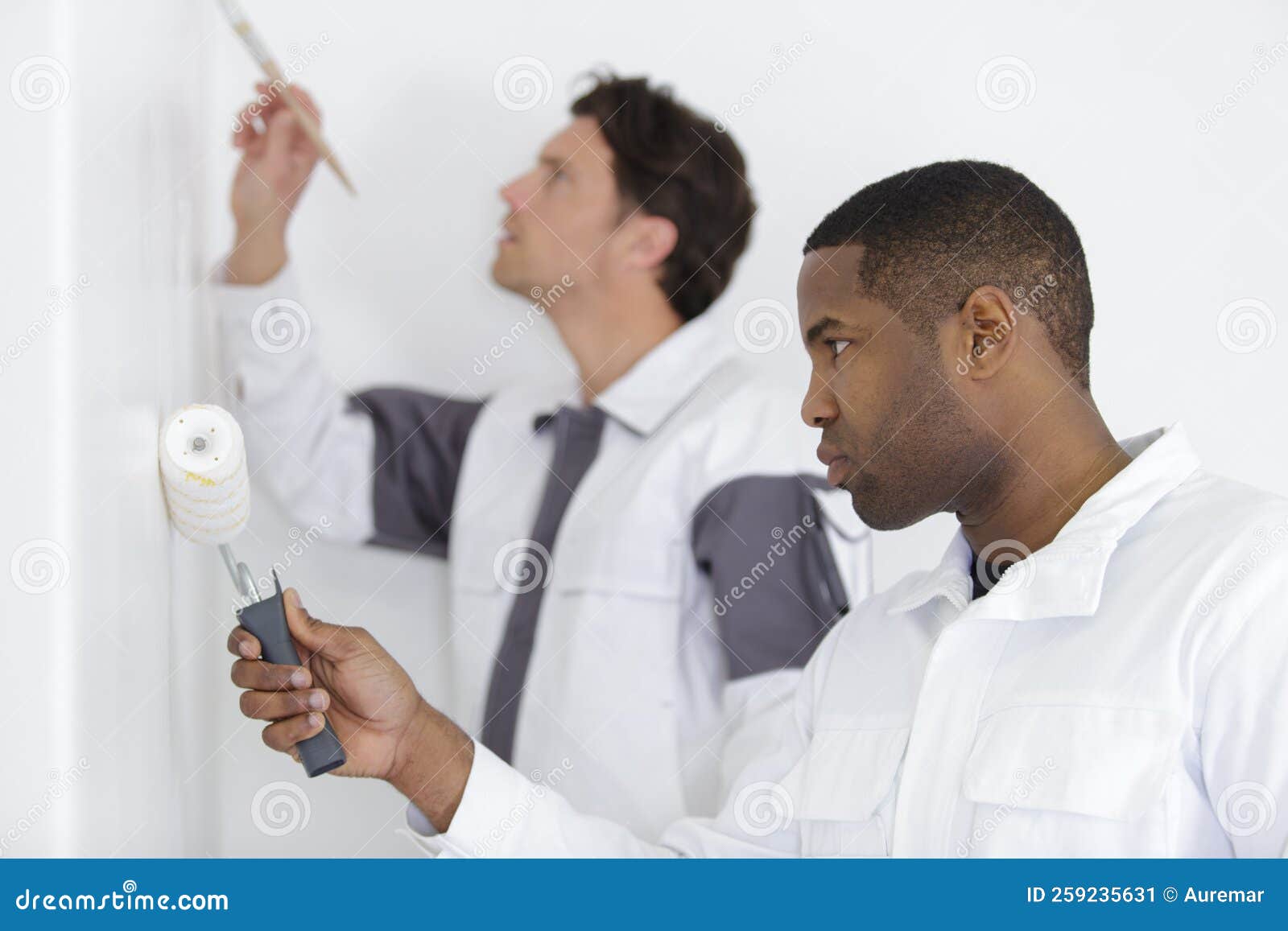Two painters at work stock image. Image of decorator - 259235631