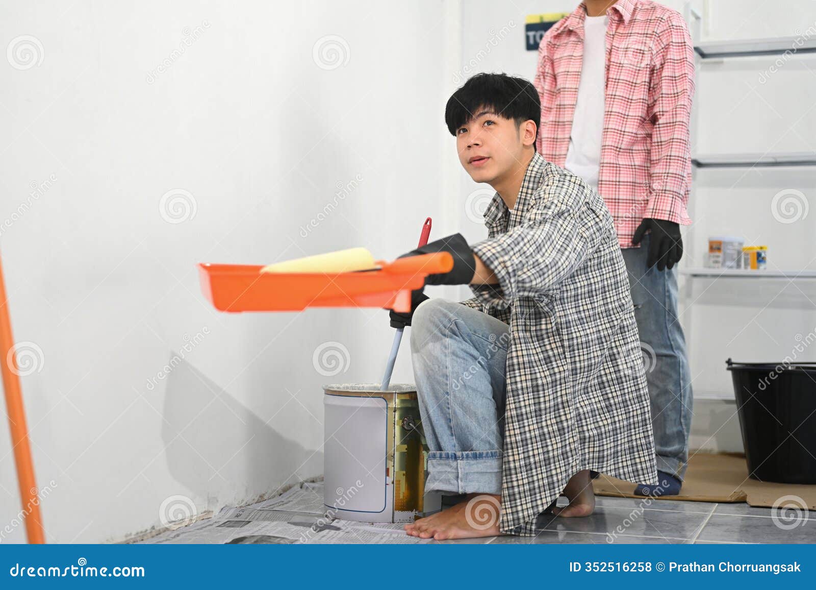 Two Painters Working on a Painting Project in an Indoor Space. Stock ...