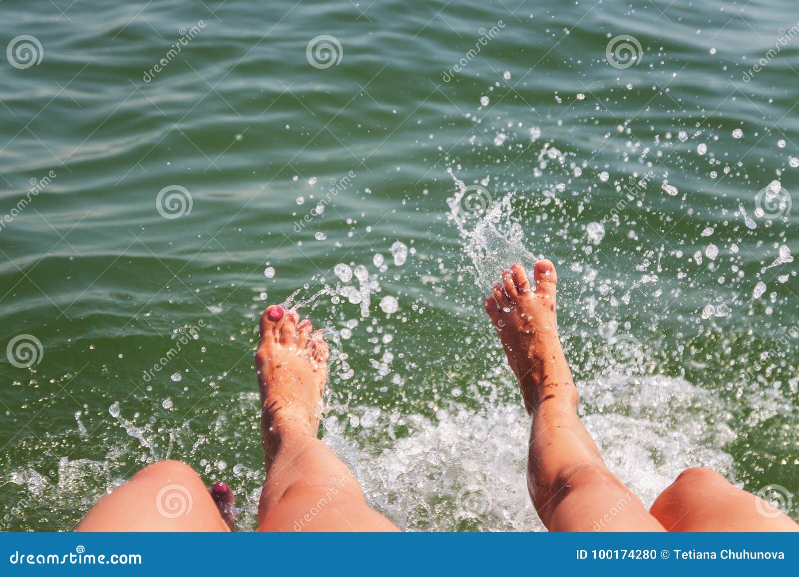 Two Pairs of Feet Splash in the Water Stock Photo - Image of foot, lake ...