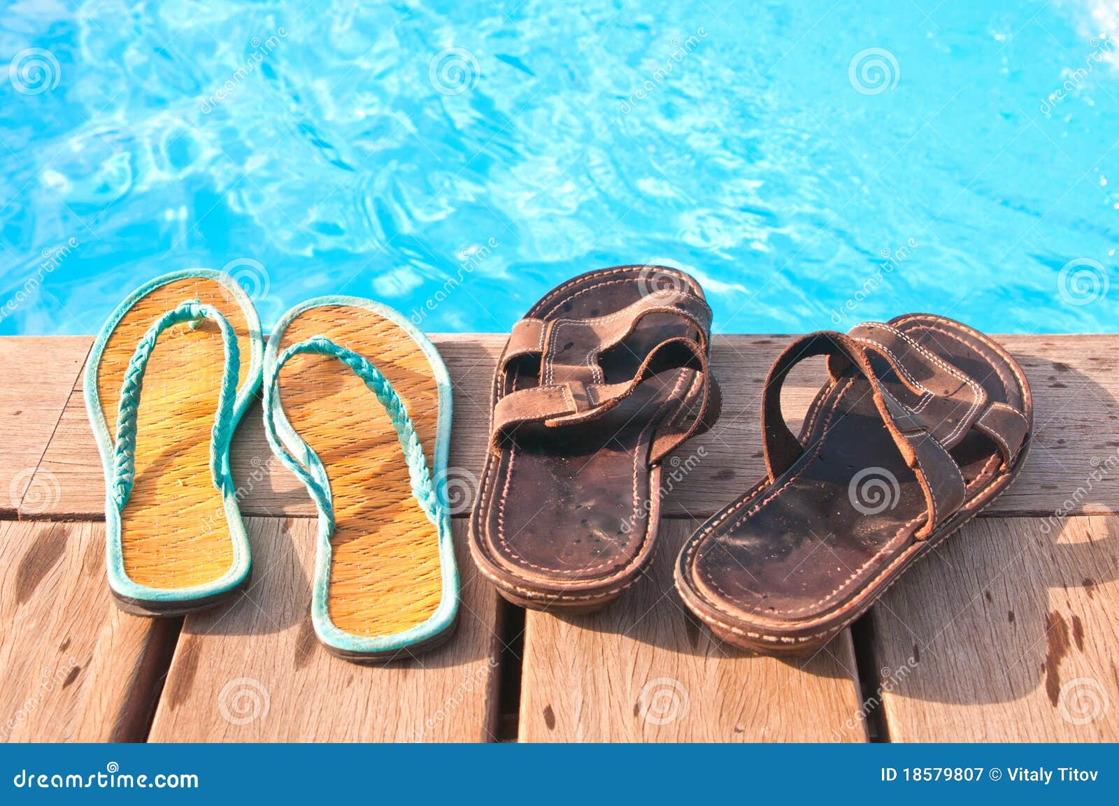 Two Pairs of Flip-flops by Swimming Pool Stock Image - Image of resort ...